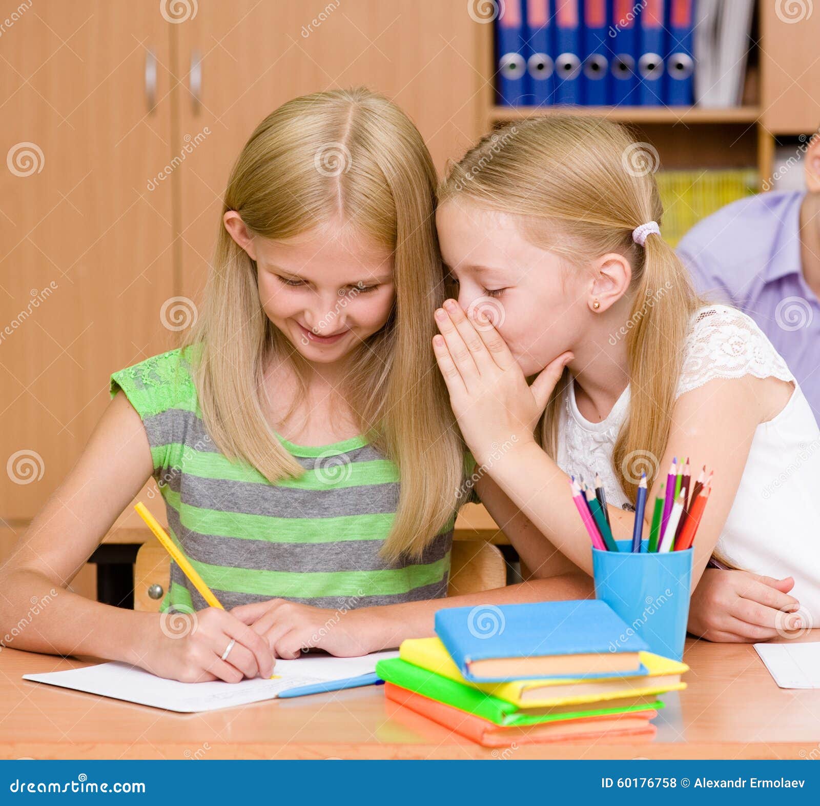Girls Sharing Secrets in Classroom Stock Photo - Image of help ...