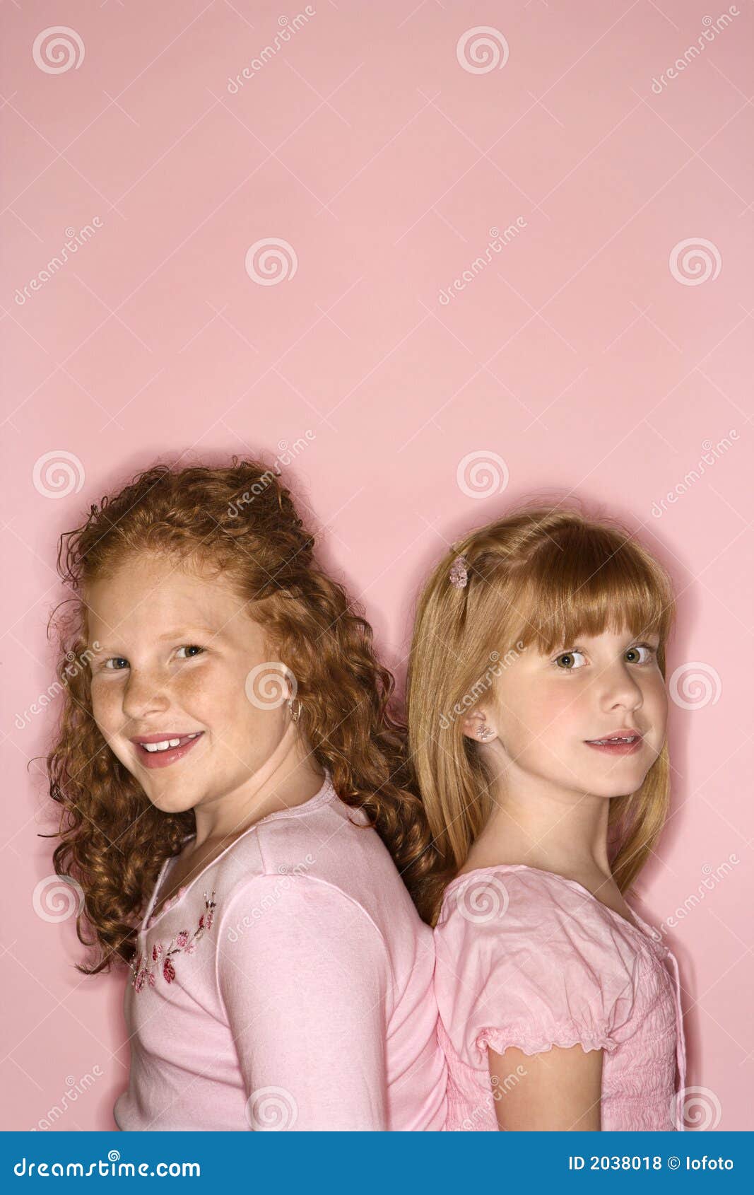 Girls Standing Back To Back. Royalty Free Stock Photos - Image: 2038018