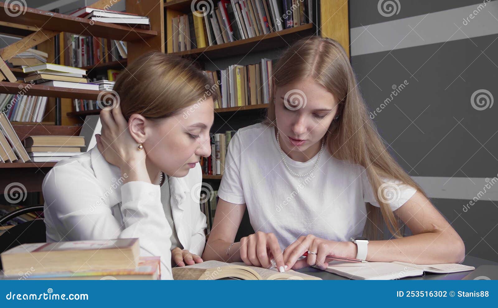 4K. the Girls Study Together in the Library. Students Prepare for Exams ...