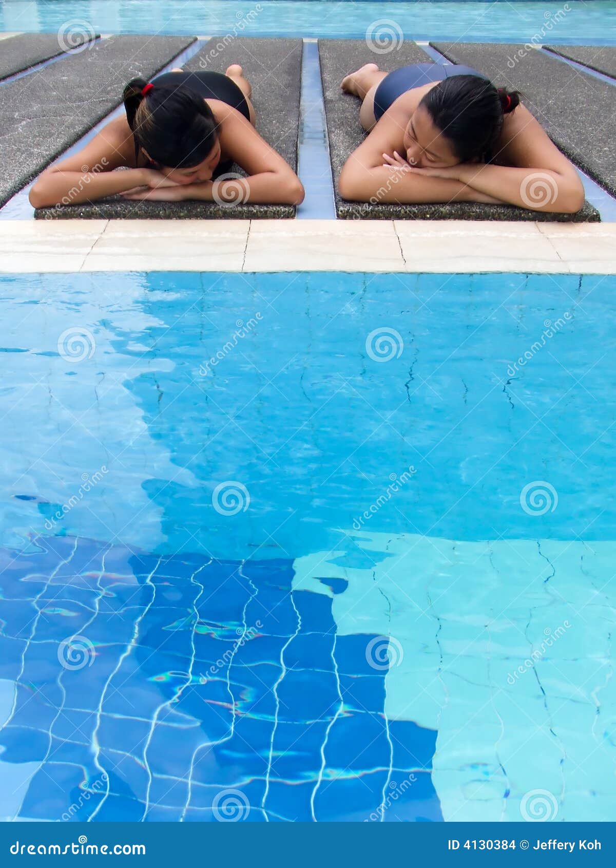 Girls sun tanning at Pool stock photo. Image of suntanning - 4130384