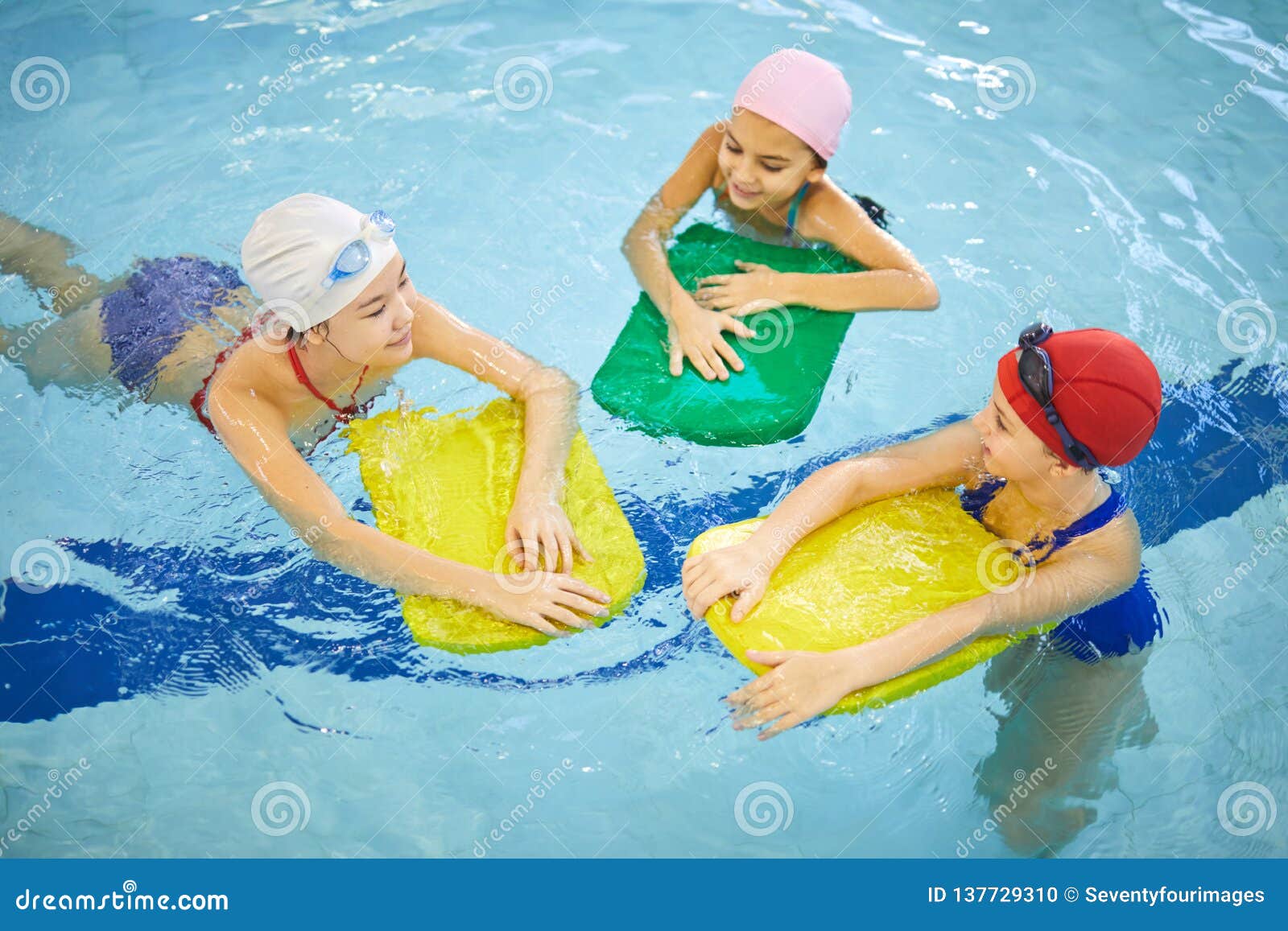 Girls swimming in pool stock photo. Image of healthy - 137729310