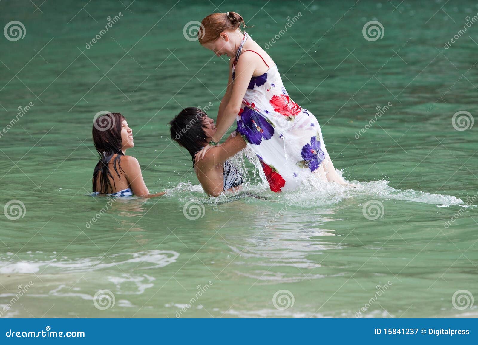 Girls swimming in the sea stock image. Image of experience - 15841237