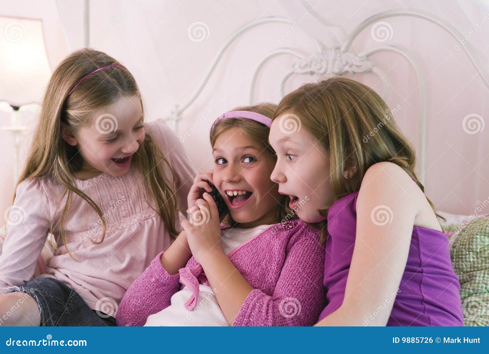 Girls talking on a phone stock photo. Image of pleased - 9885726
