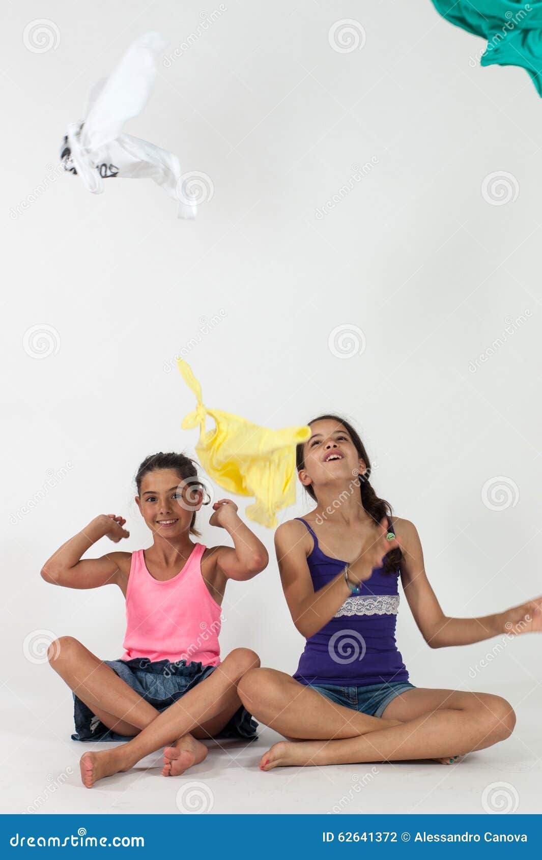 Girls Throwing Clothes in the Air Stock Photo - Image of clothes ...