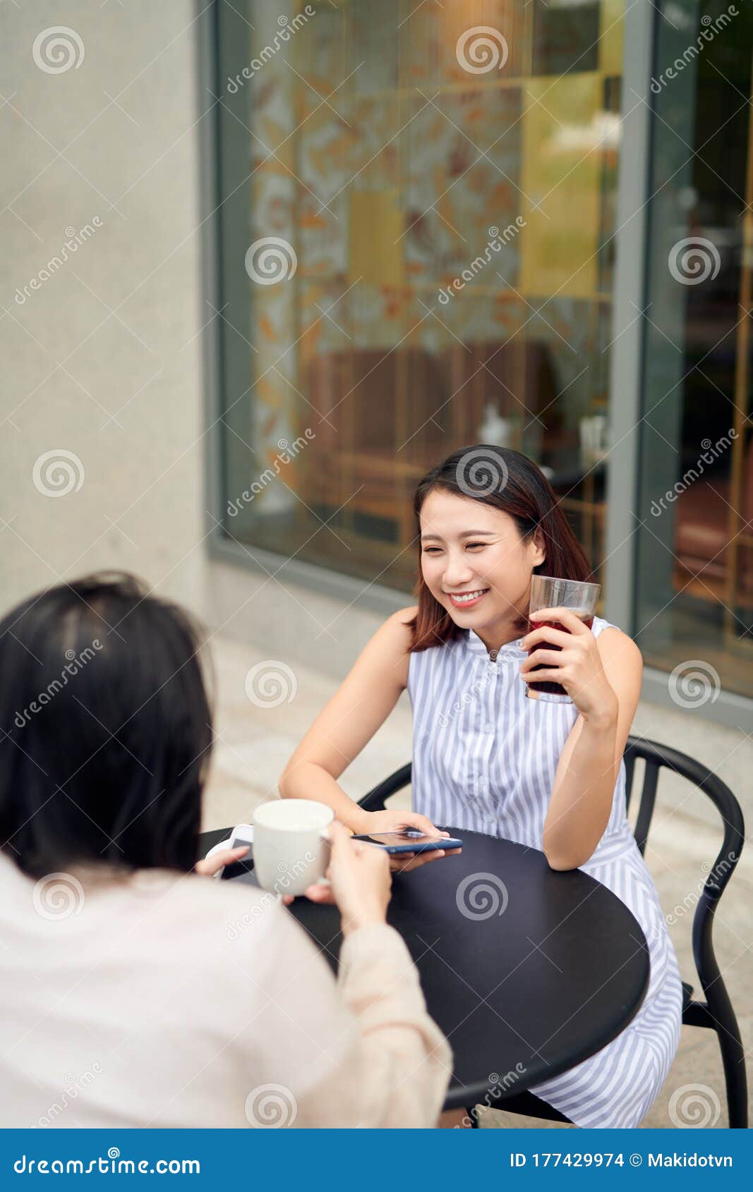 Girls Use Their Break from Work To Drink Coffee and Chat Stock Photo ...