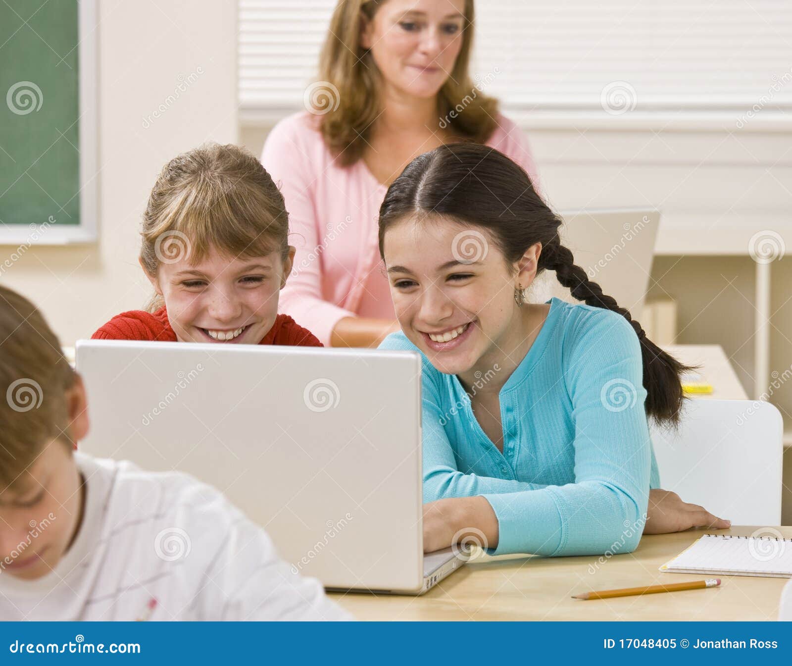 Girls Using Laptop in Classroom Stock Image - Image of laugh, smiling ...