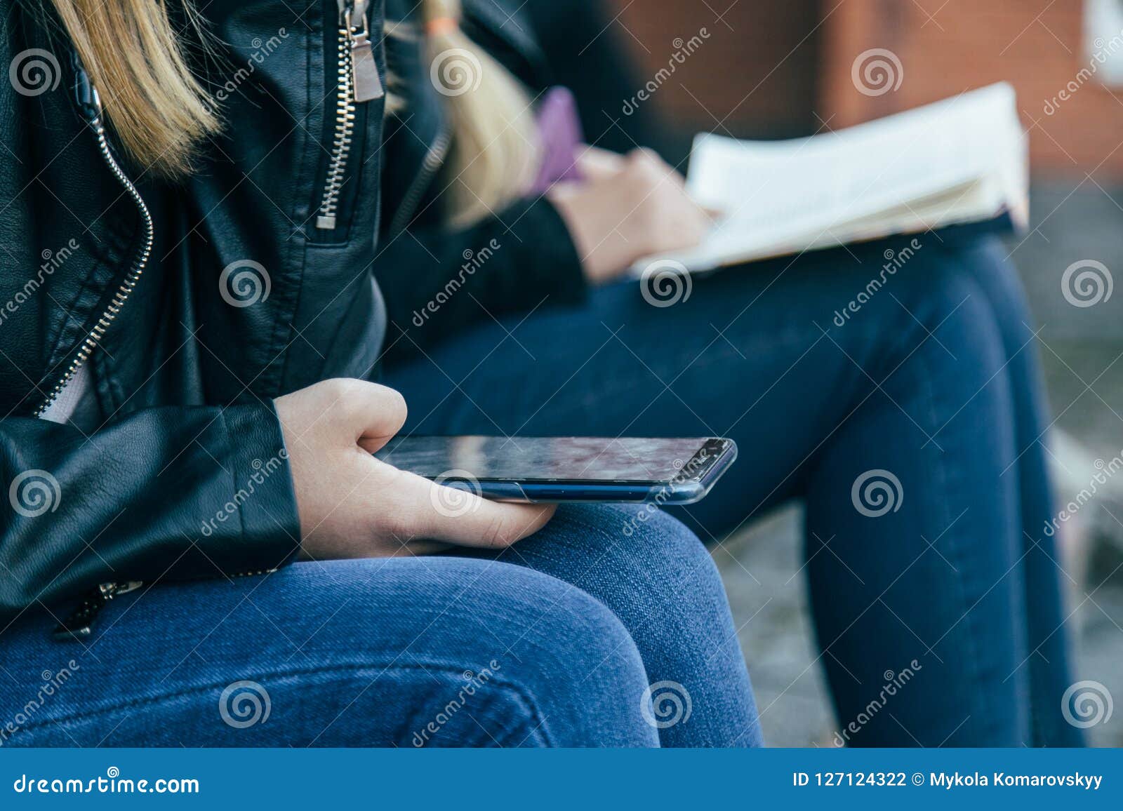 Smart phone and book. stock photo. Image of lifestyle - 127124322