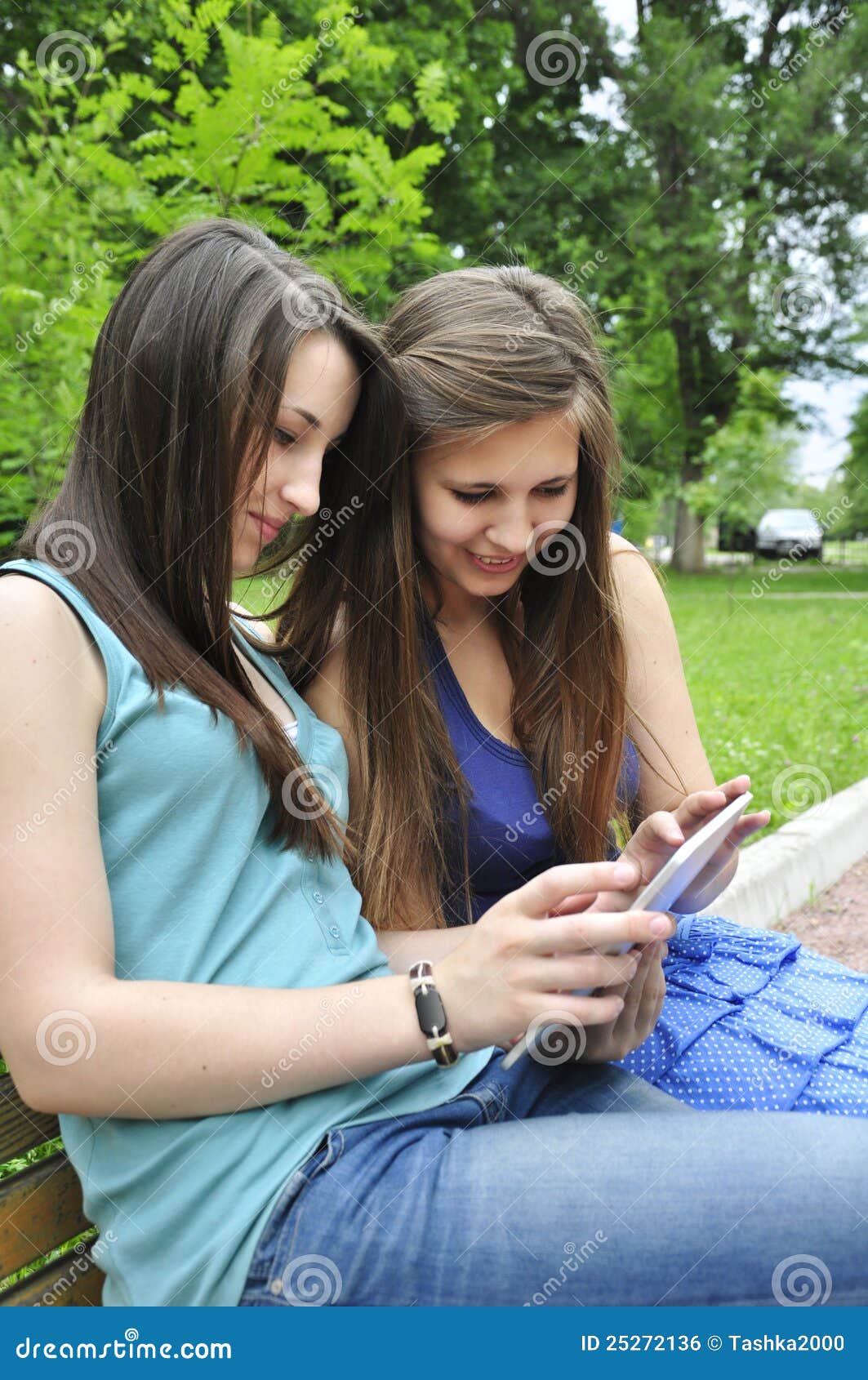 Girls using a tablet pc stock photo. Image of pretty - 25272136
