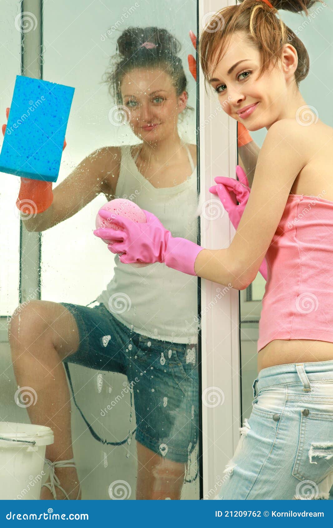 Girls washing the window stock photo. Image of motion - 21209762