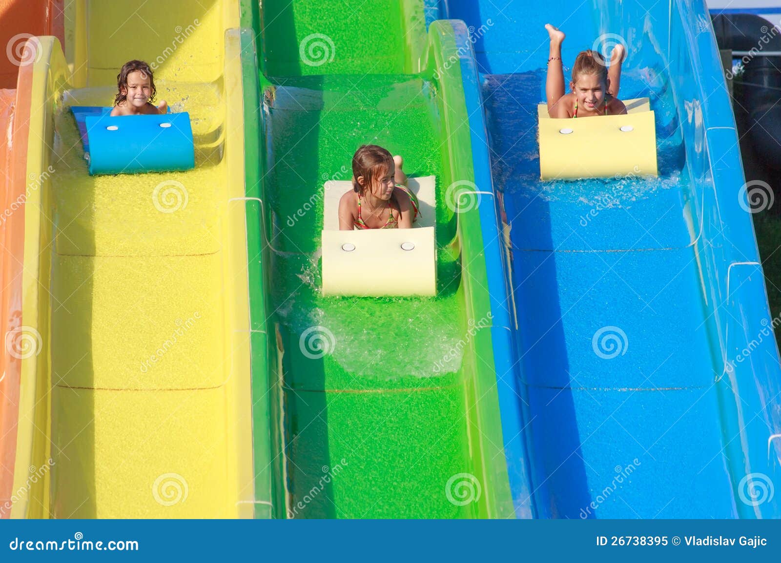Girls on the water slide stock image. Image of aqua, aquatic - 26738395
