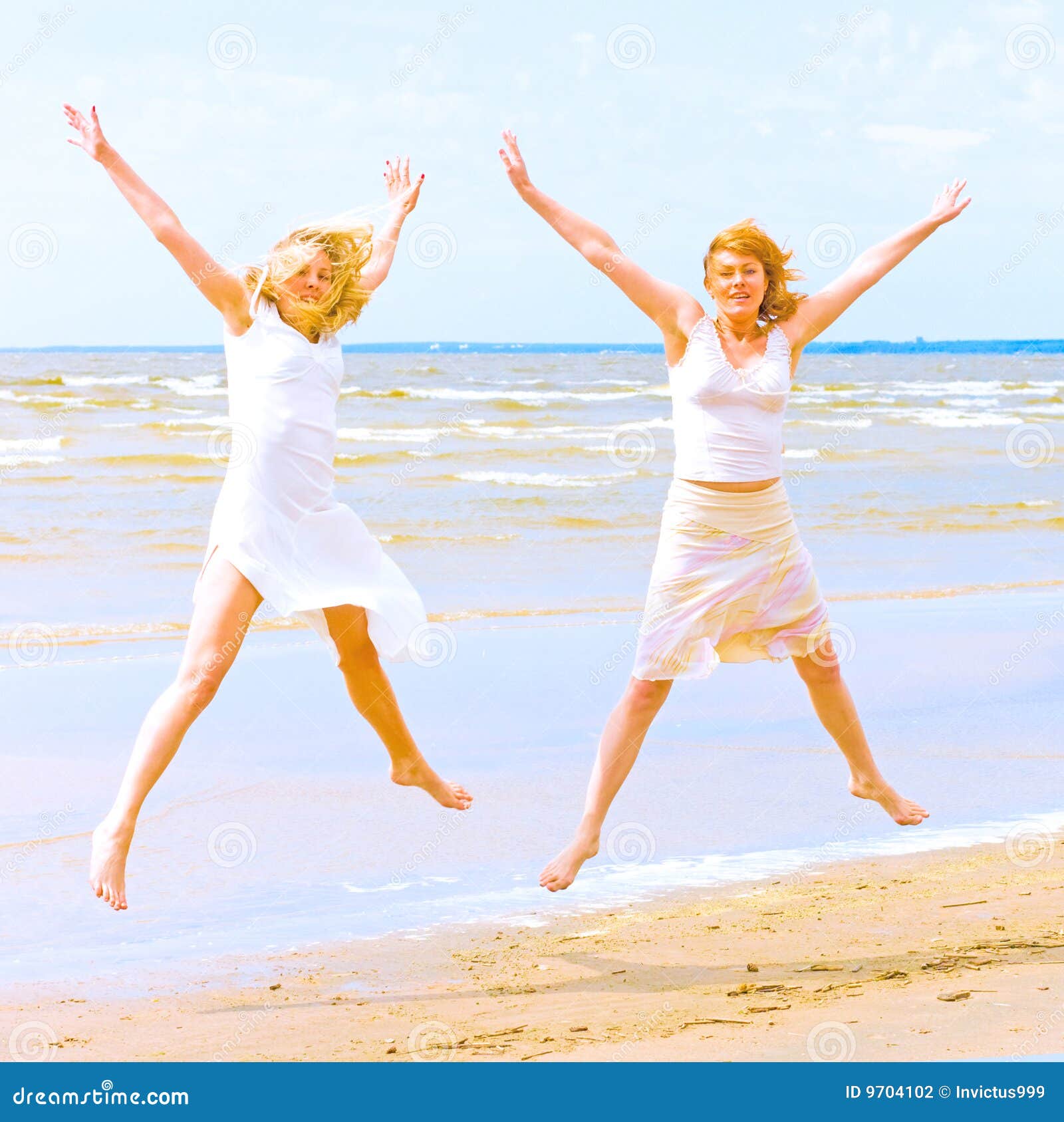 Girls in White Jumping Happily on a Beach Stock Photo - Image of active ...
