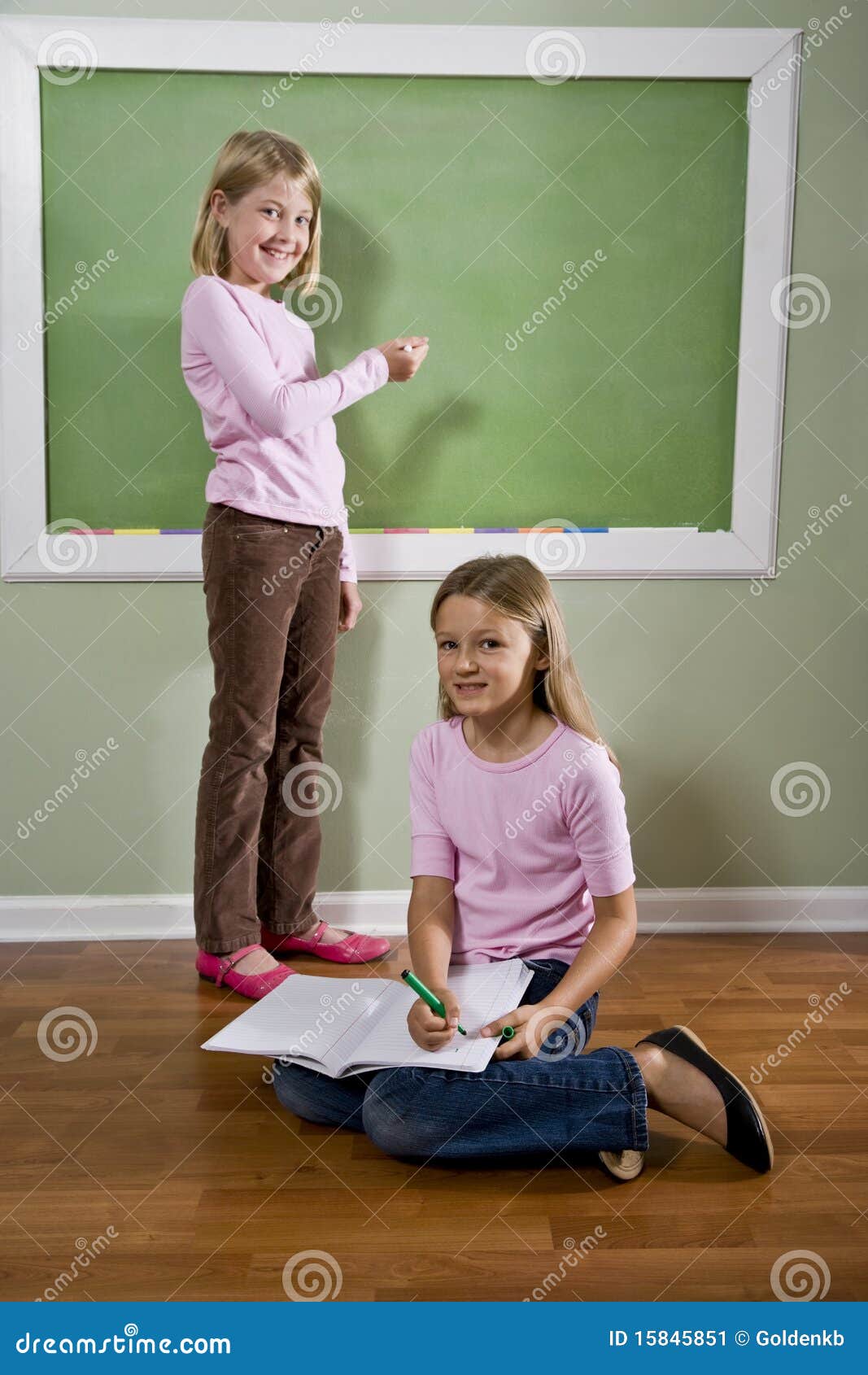 Girls Writing on Blackboard and Doing Homework Stock Image - Image of ...