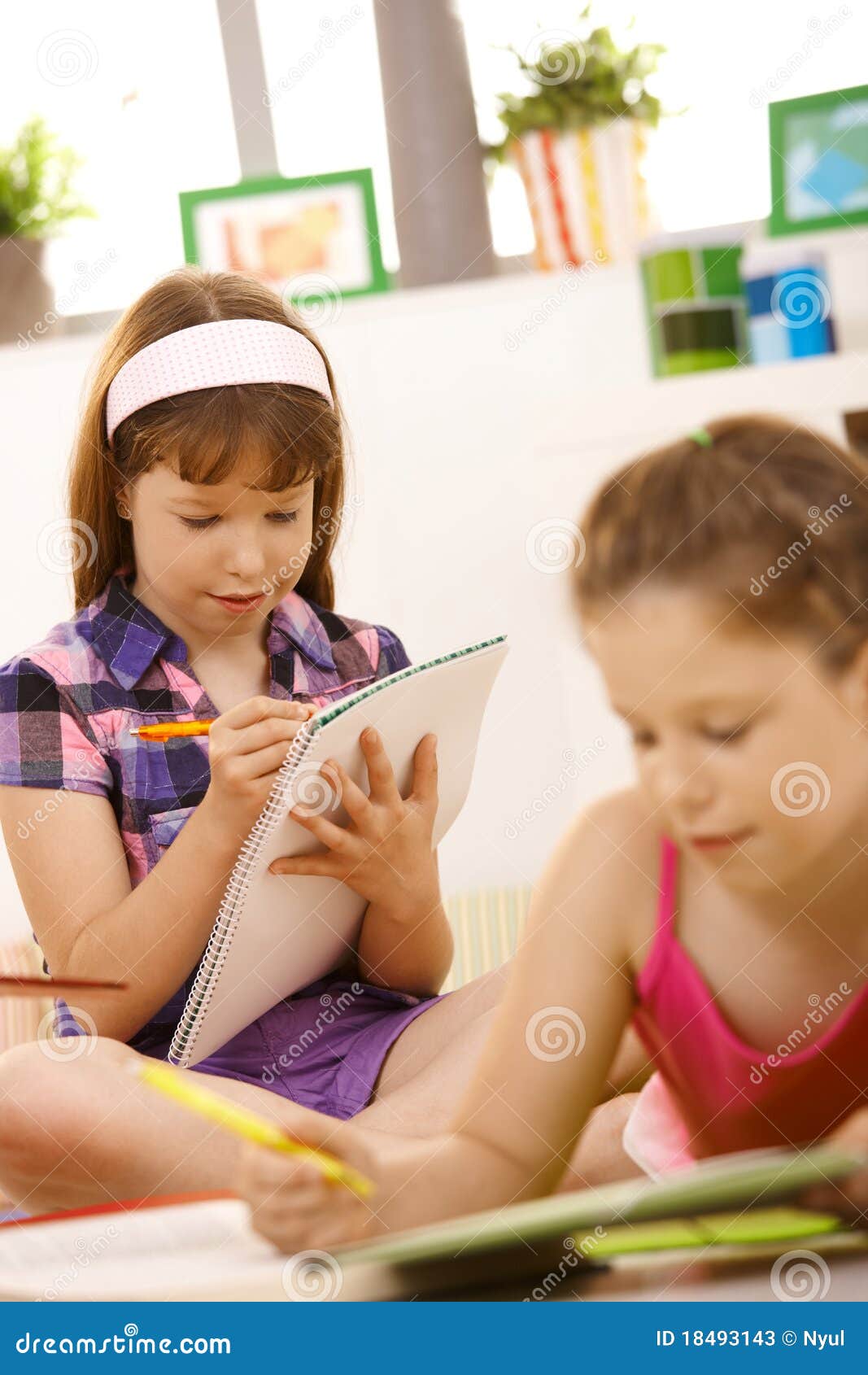 Girls writing homework stock image. Image of daughter - 18493143