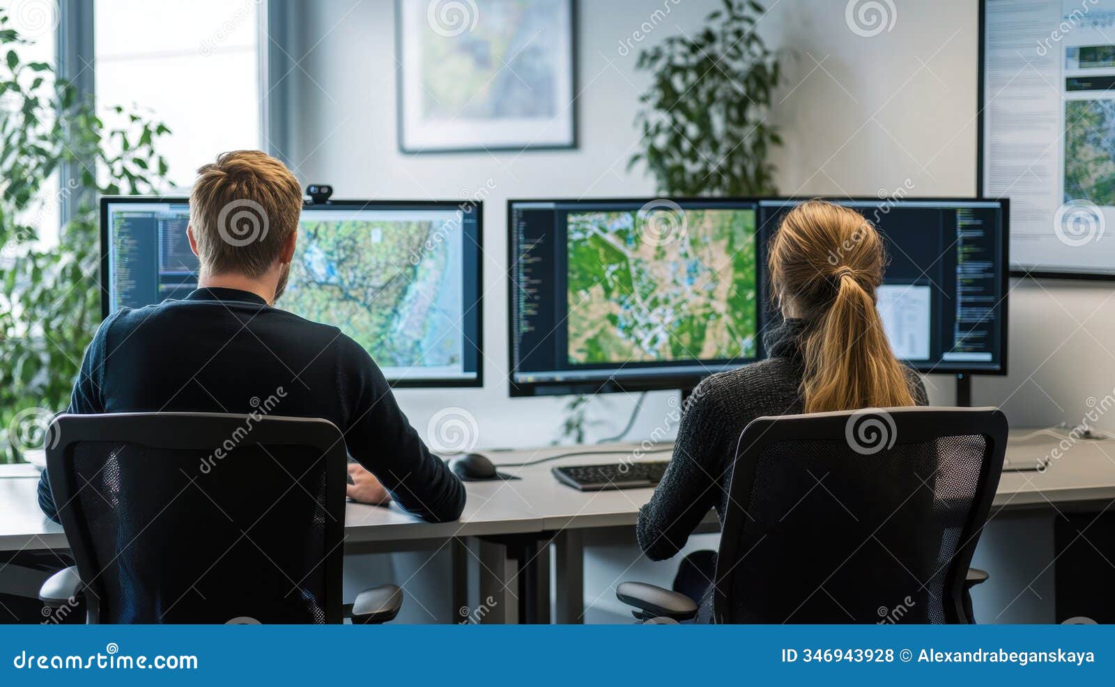 GIS Day Geospatial Analysis Team Examining Maps on Multiple Monitors in ...