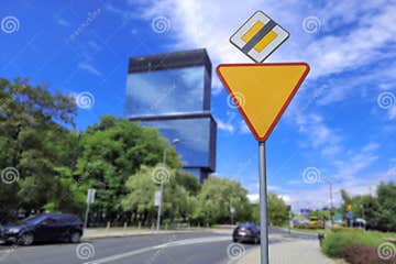 Give Way Priority Sign and Sign End Main Road Against the Backdrop of ...
