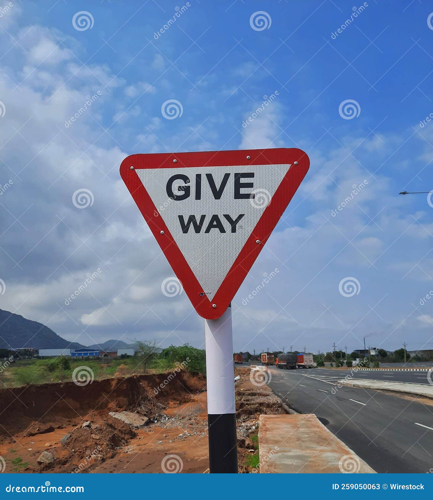 Give Way Sign on the Road Under Blue Sky Stock Image - Image of nature ...