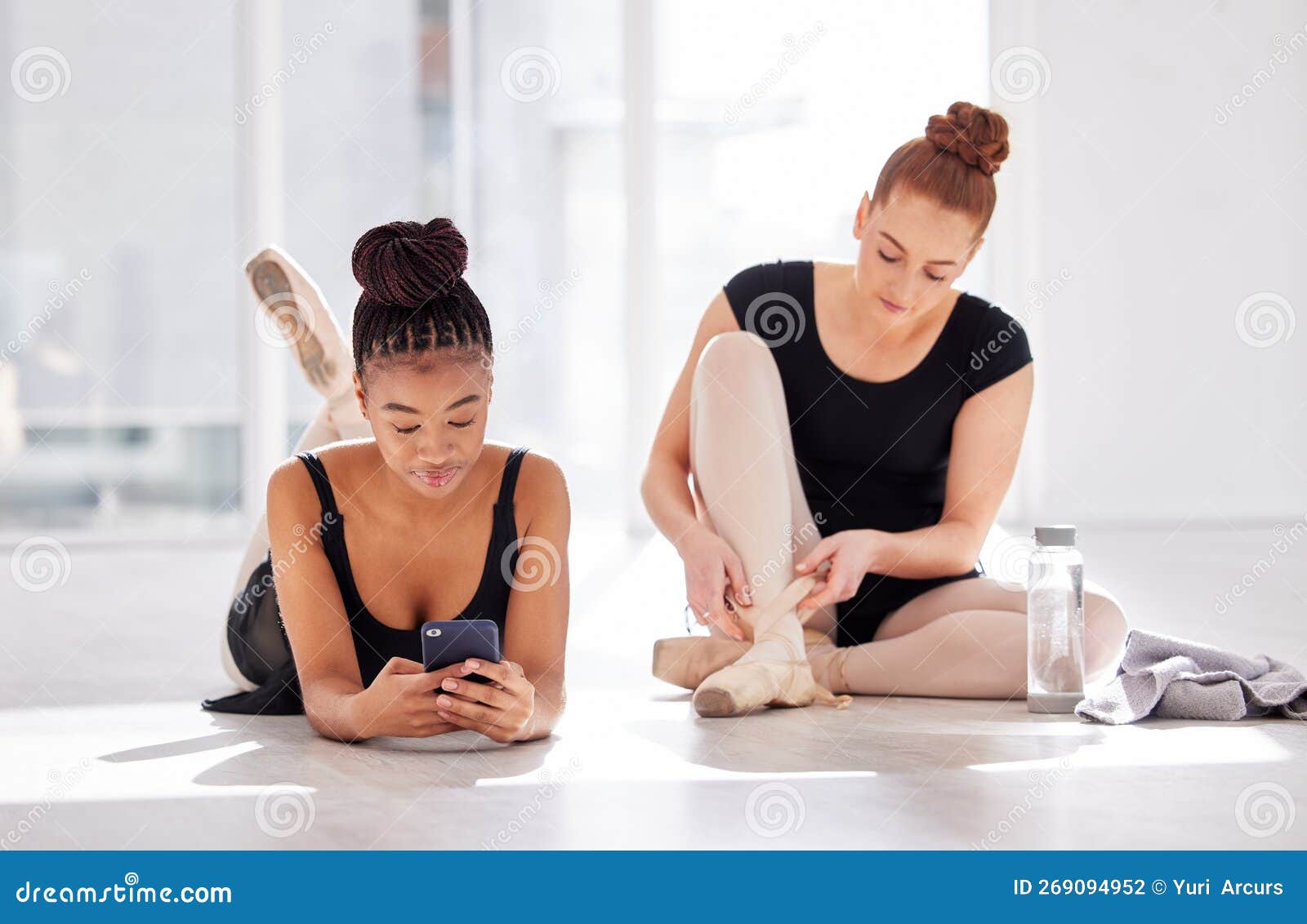 Give Your Body the Break it Deserves. Two Ballet Dancers Taking a Break ...