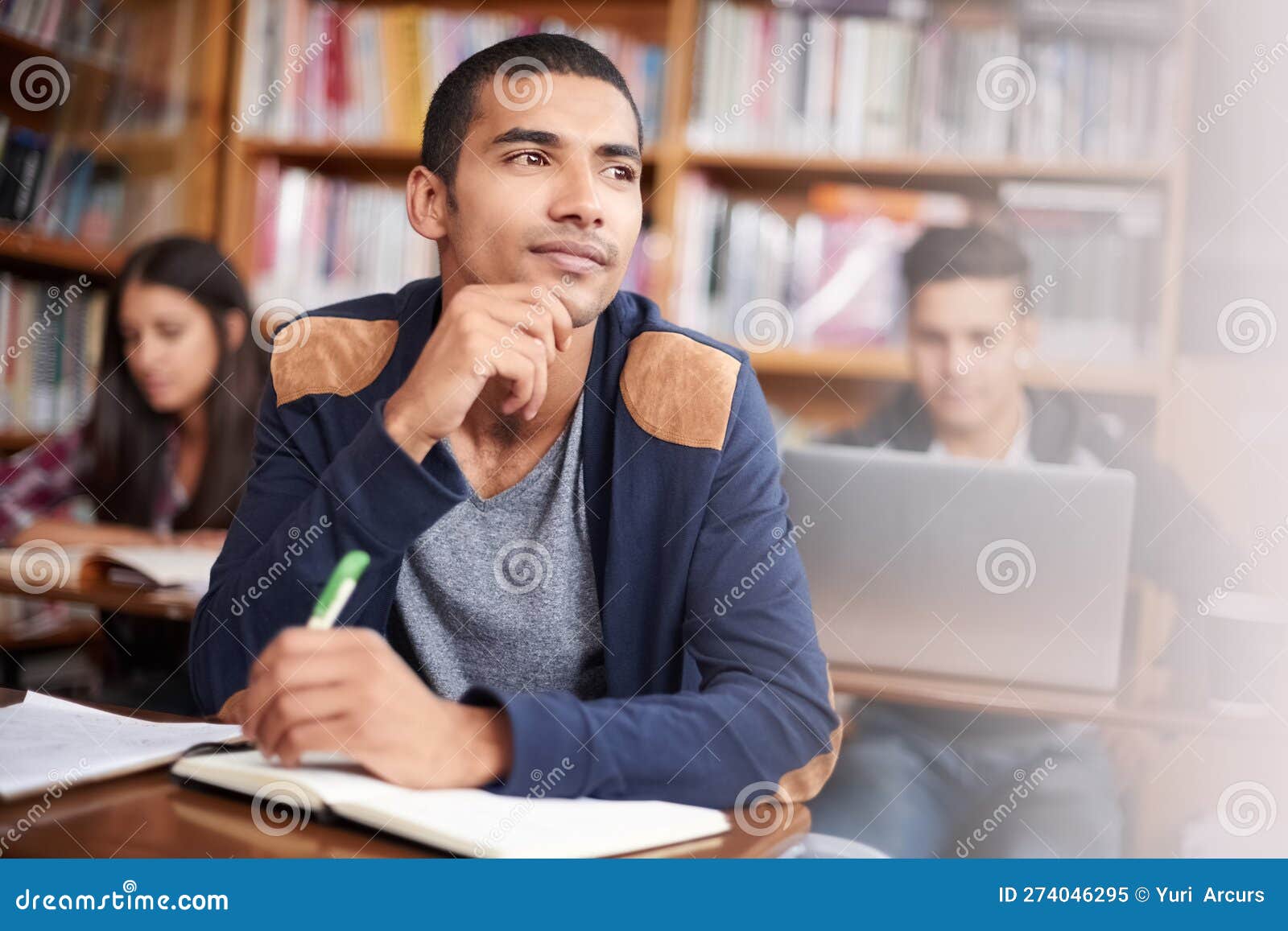 Giving the Assignment a Little Thought. a Handsome Young Student ...