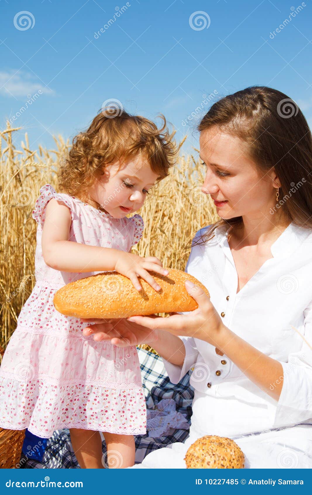 Giving a bread loaf stock image. Image of countryside - 10227485