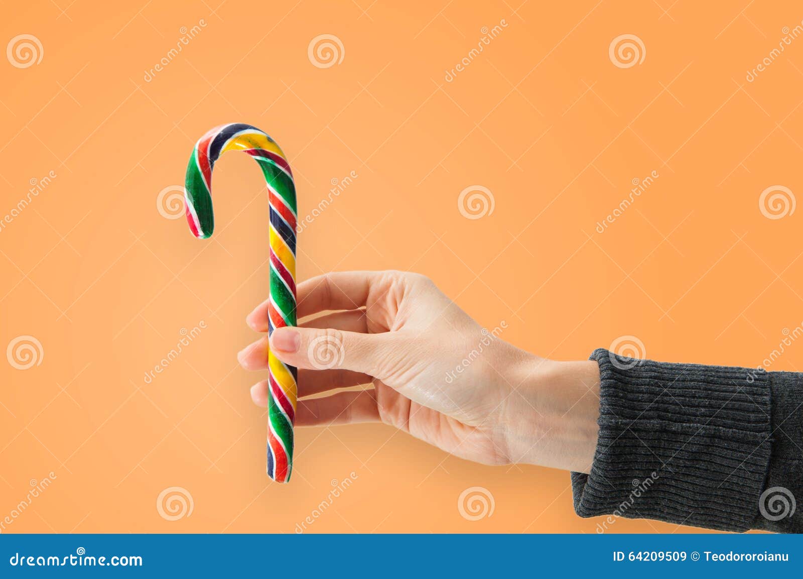Giving a candy cane stock image. Image of isolated, bright - 64209509