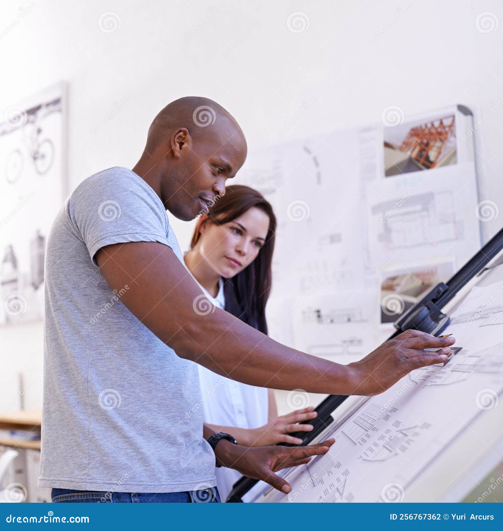 Giving Each Other Input. Two Architects Working Together at a Drawing ...