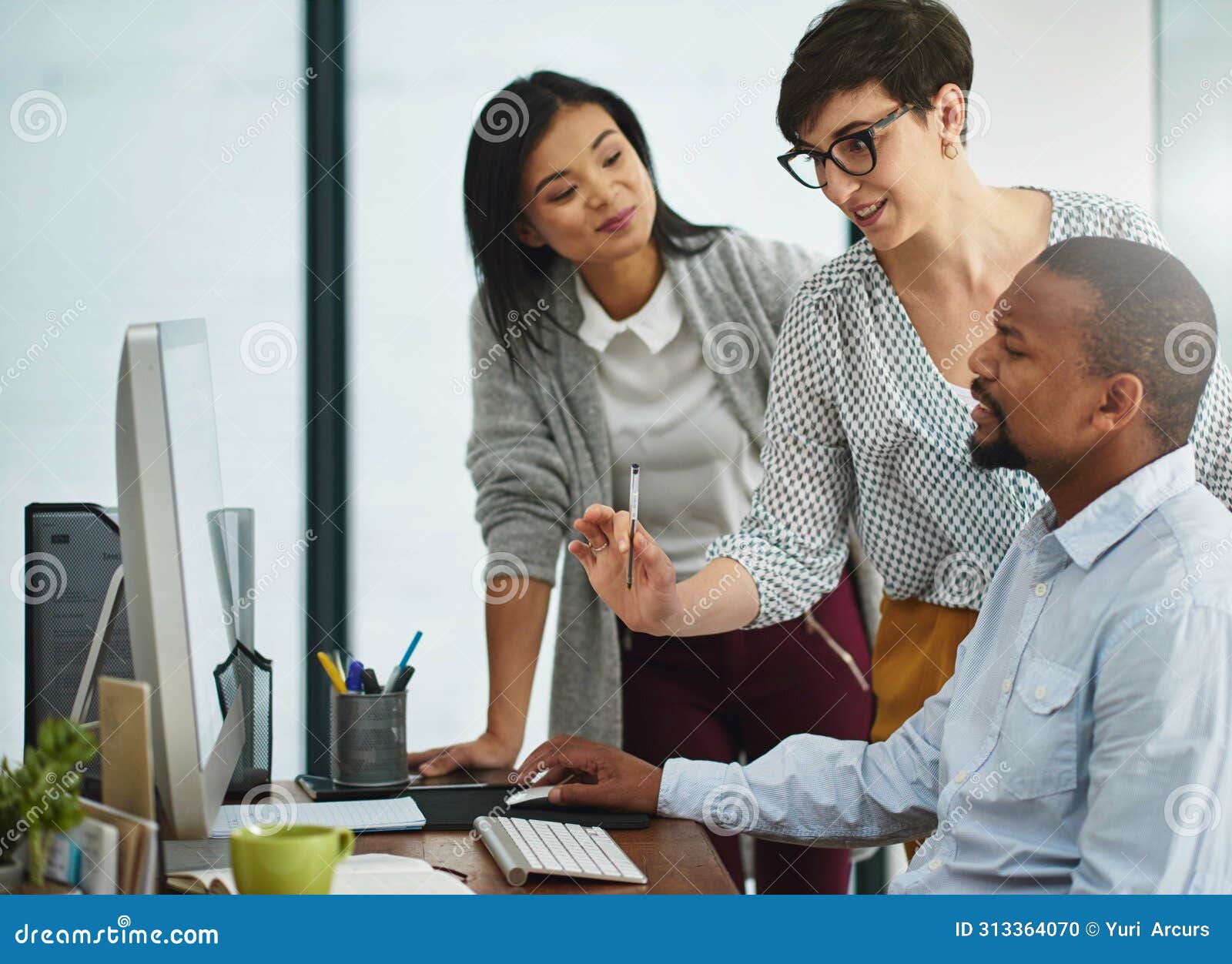 Giving Her Input. Cropped Shot of a Group of Colleagues Working in ...