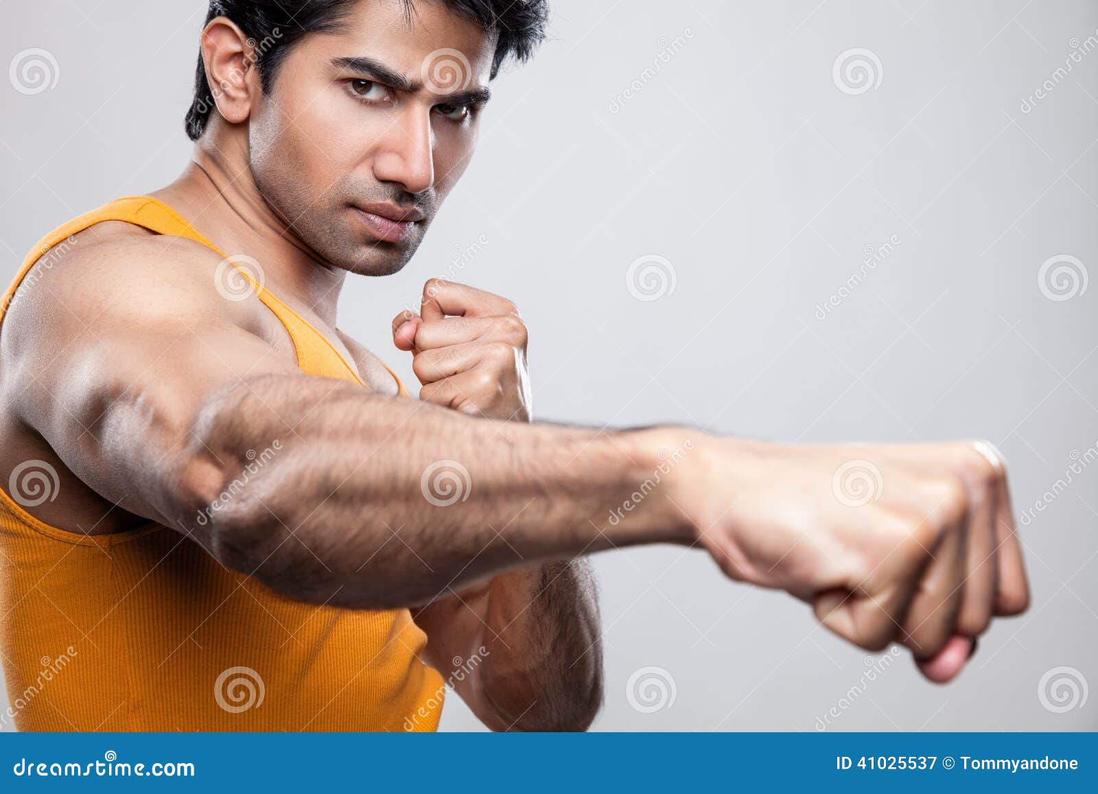 Knockout Punch. Male Boxer In Red Uniform And Boxing Gloves Training On ...