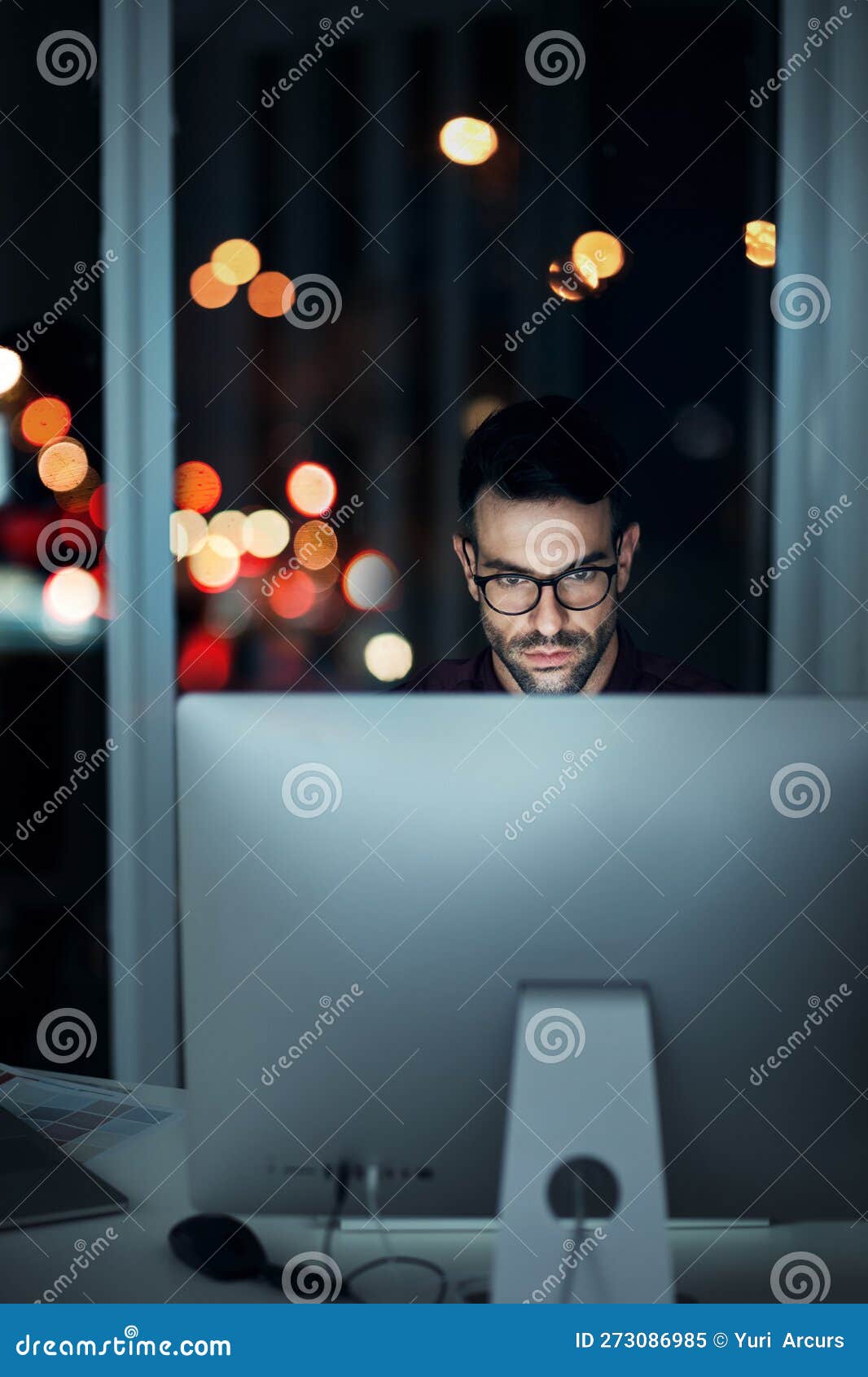 Giving the Night Shift All Hes Got. a Young Businessman Using a ...