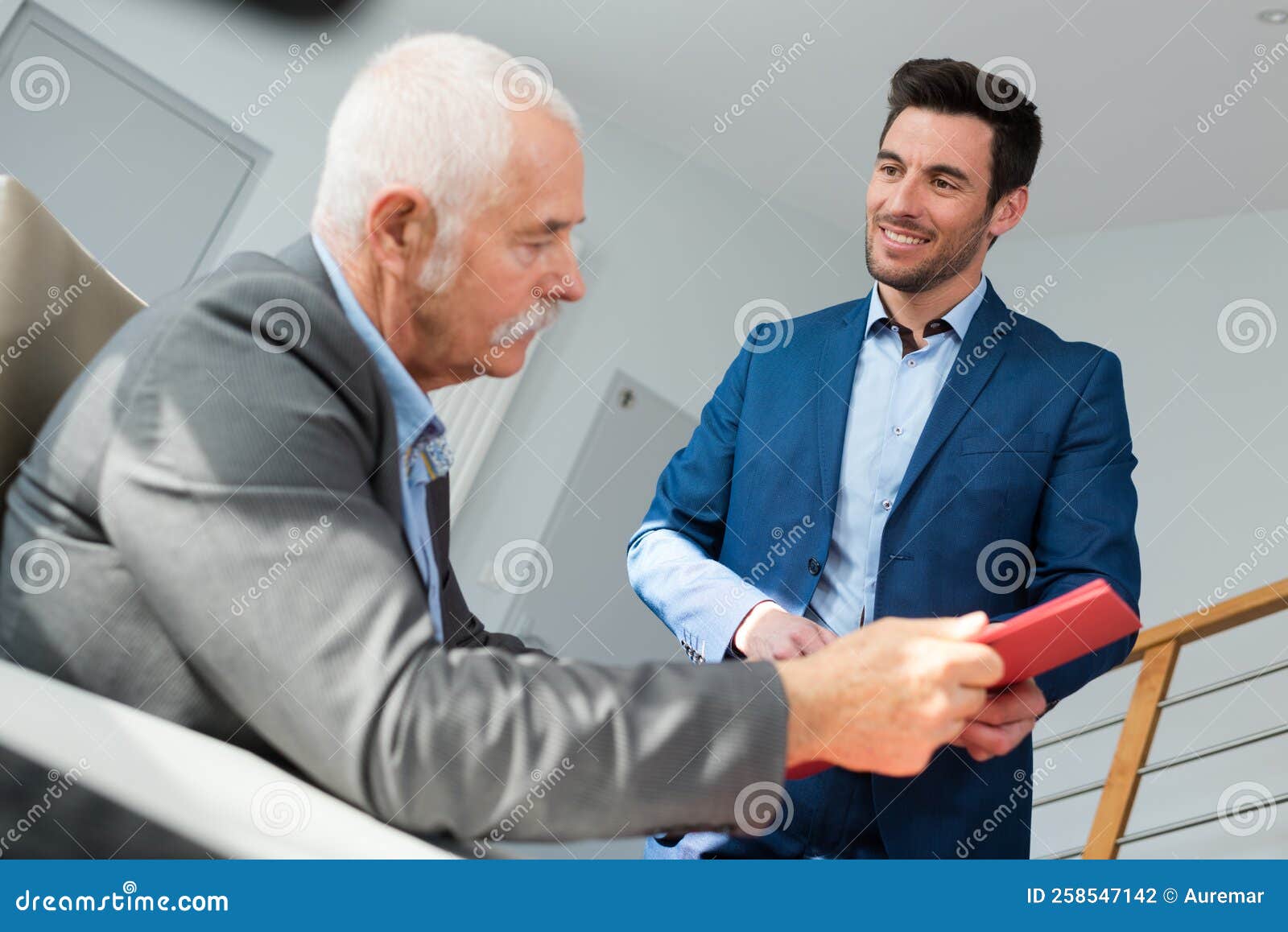 Giving proposal to boss stock photo. Image of sepia - 258547142
