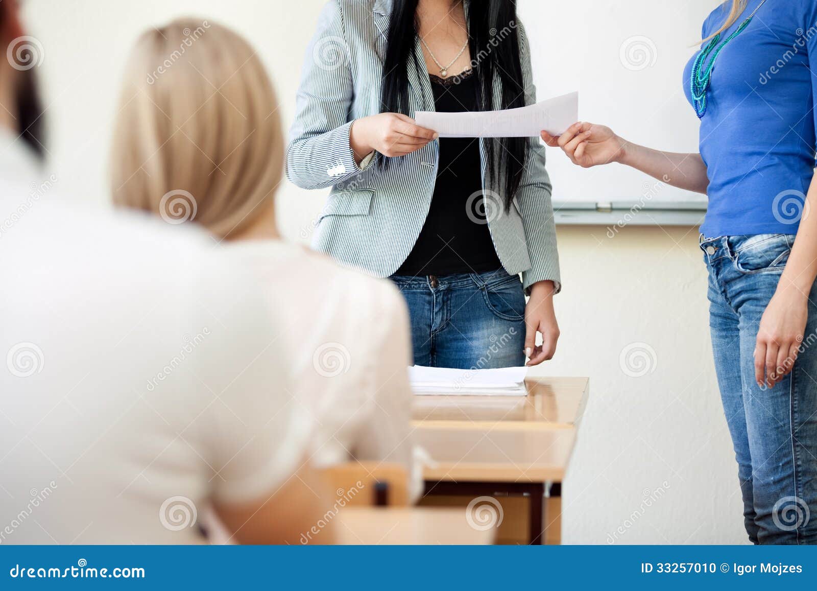 Giving or Receiving Test Paper Stock Photo - Image of classroom ...