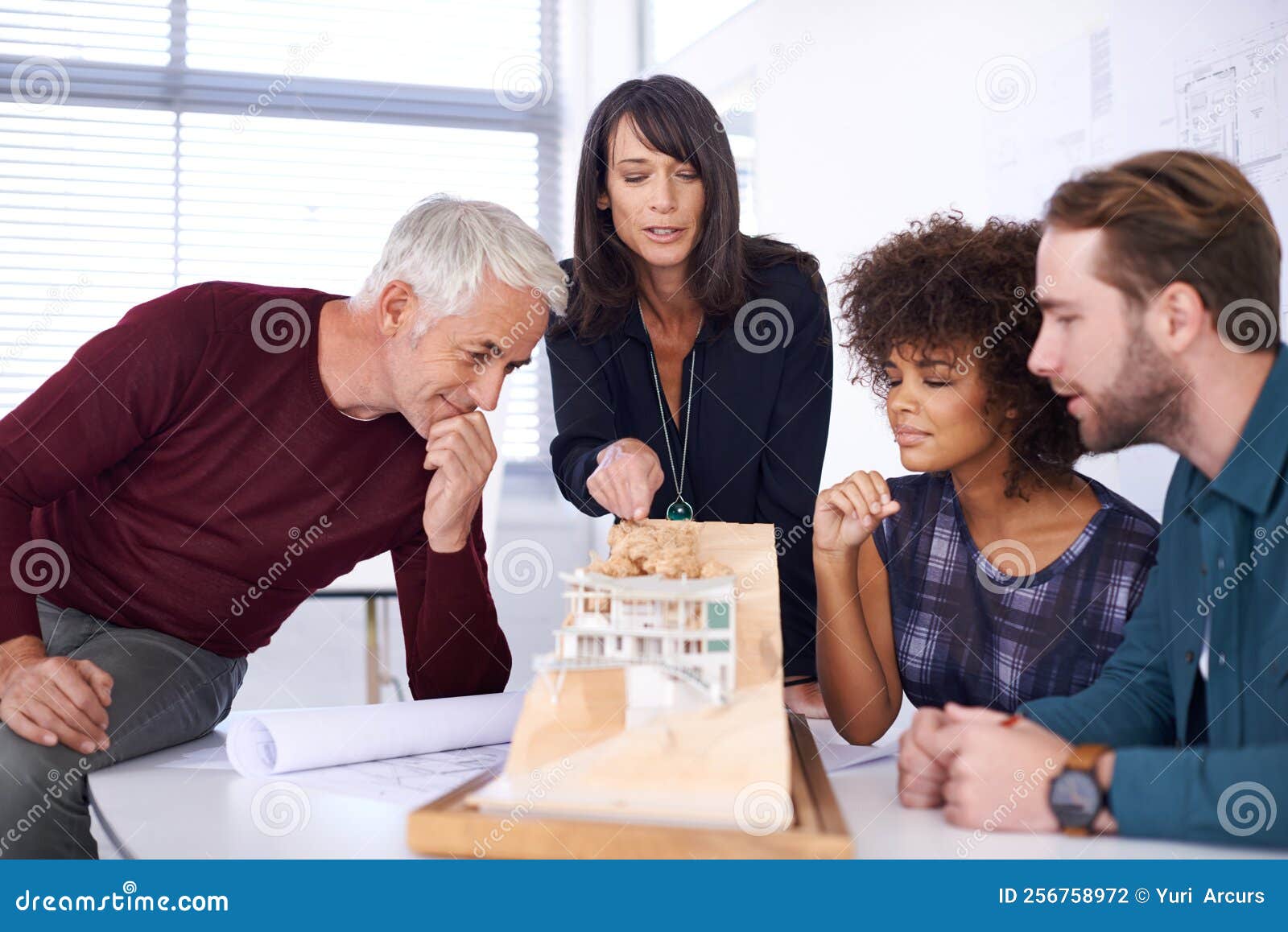 Giving Their Design Some Serious. a Group of Architects Working ...