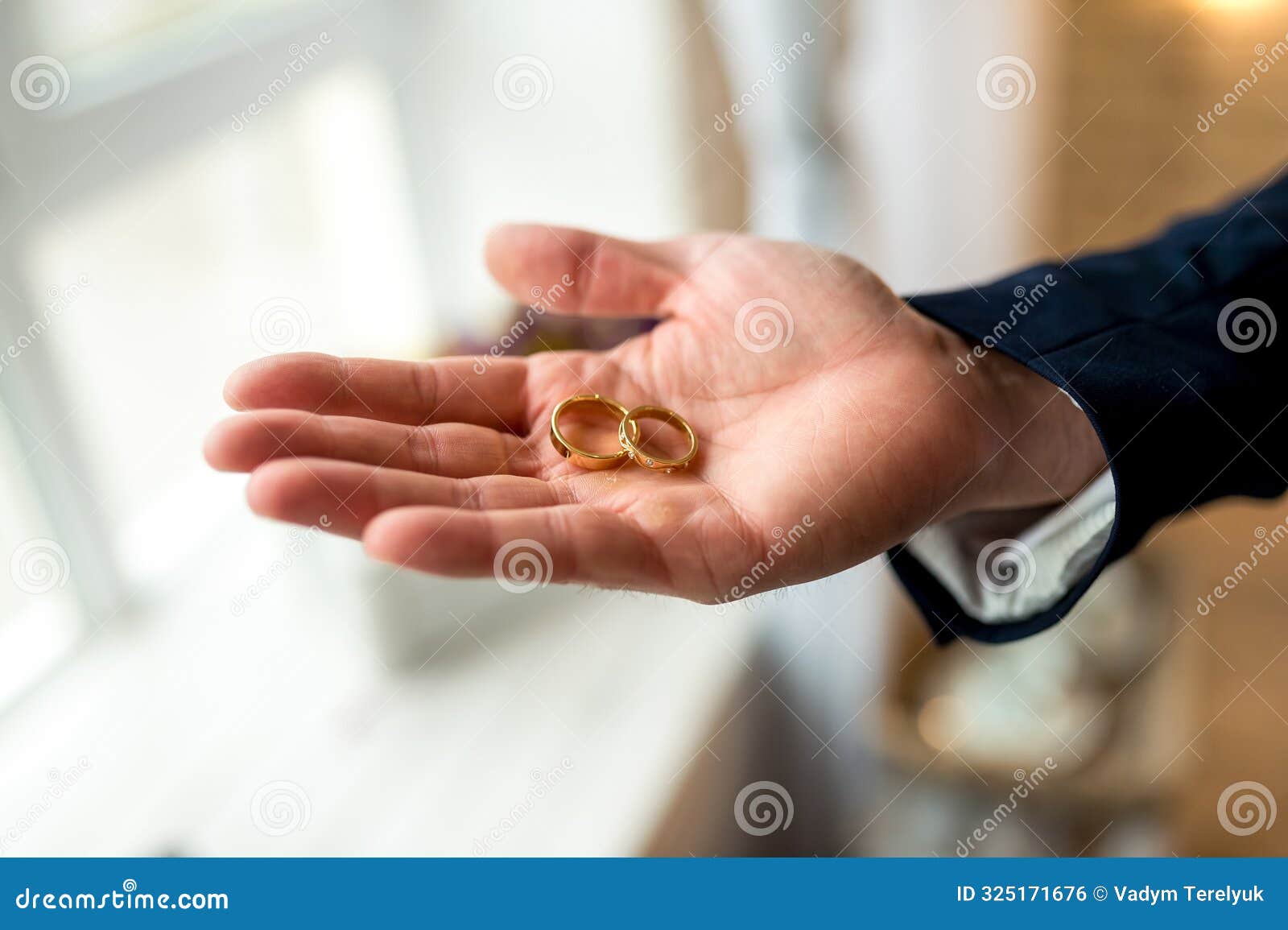 Giving of Wedding Ring. the Groom is Holding the Rings Stock Photo ...