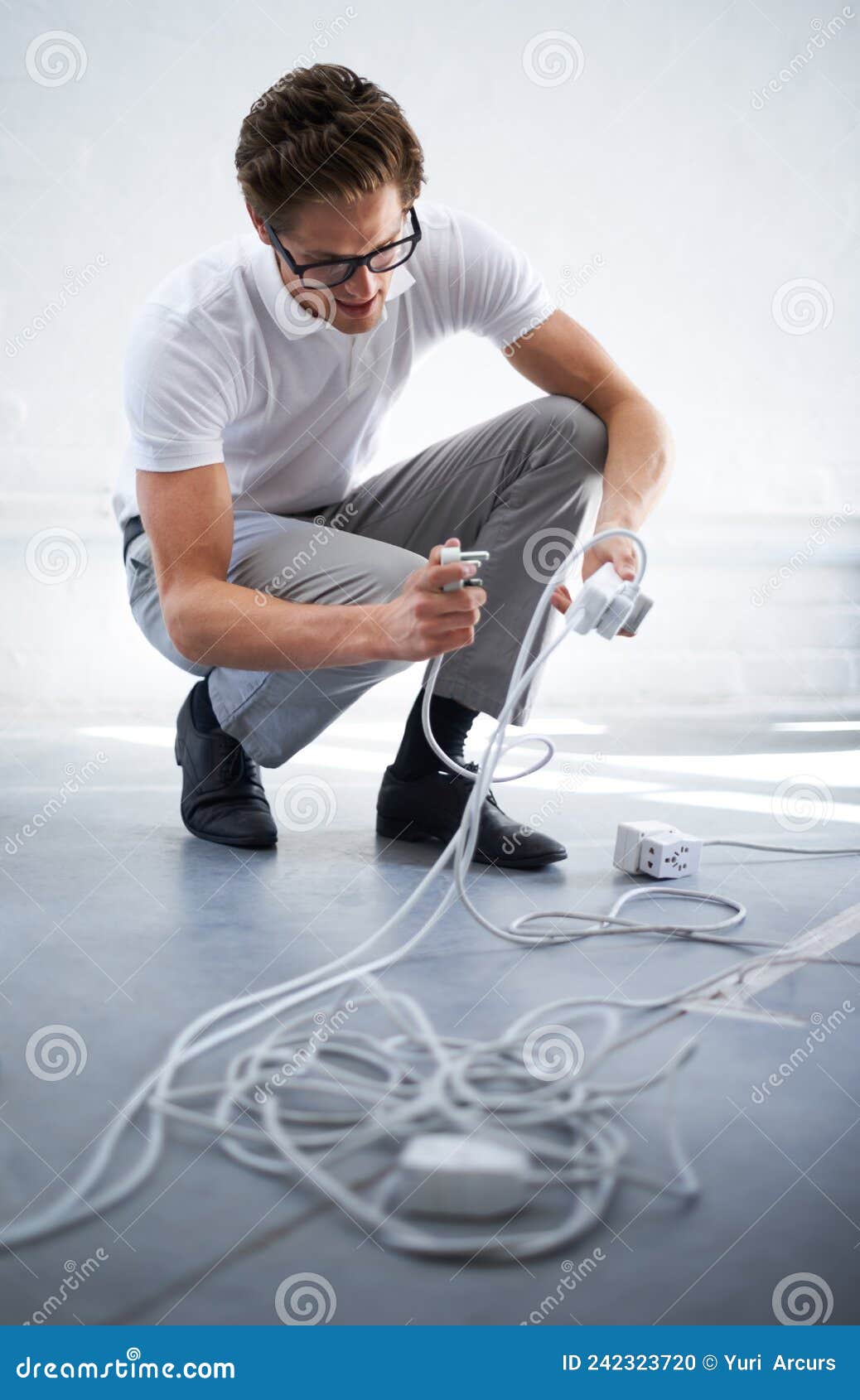 Giving Your Connection Greater Distance. a Young Man Plugging in a Plug ...