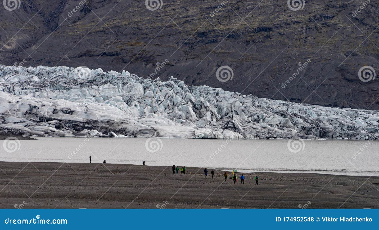 Glacier with Ash in the Ice with Melted Water and Icelandic Landscape ...