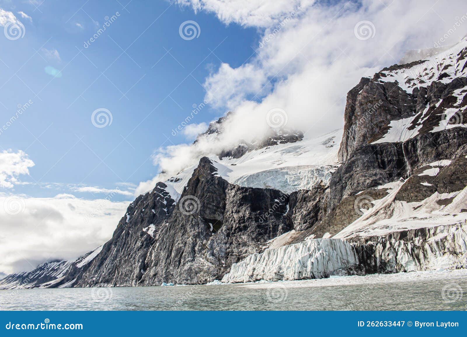 A Glacier, with Mountains and Clouds As a Backdrop in Svalbard Stock ...