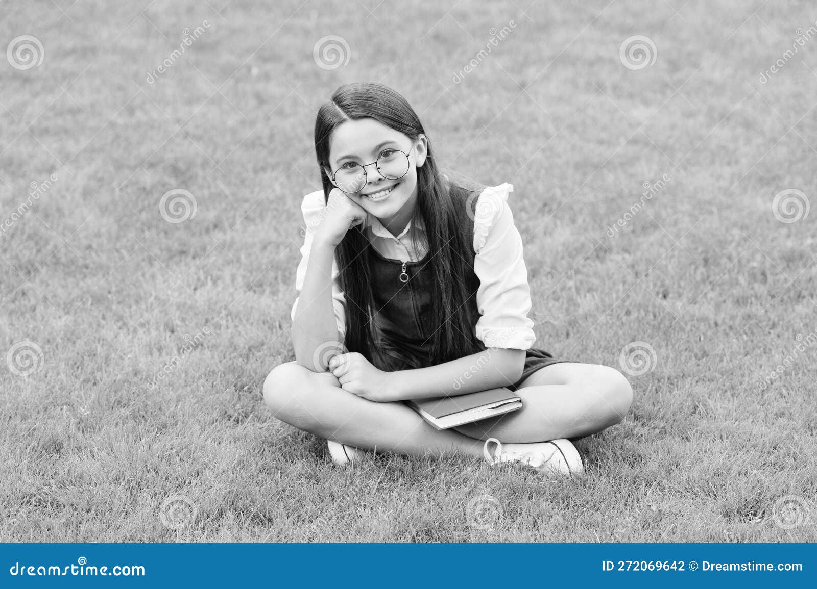 Glad Child in Glasses Sitting on Green Grass with Book Stock Photo ...