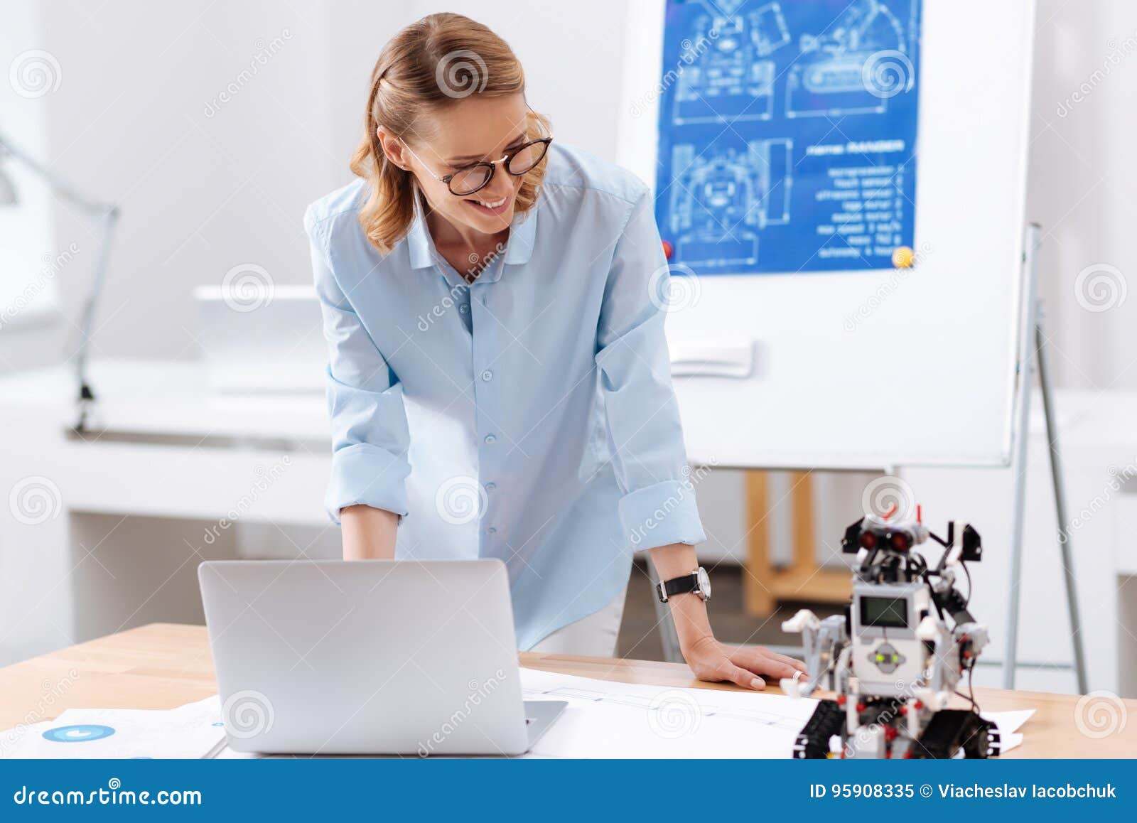 Glad Engineer Working with Automatic Robot in the Laboratory Stock ...