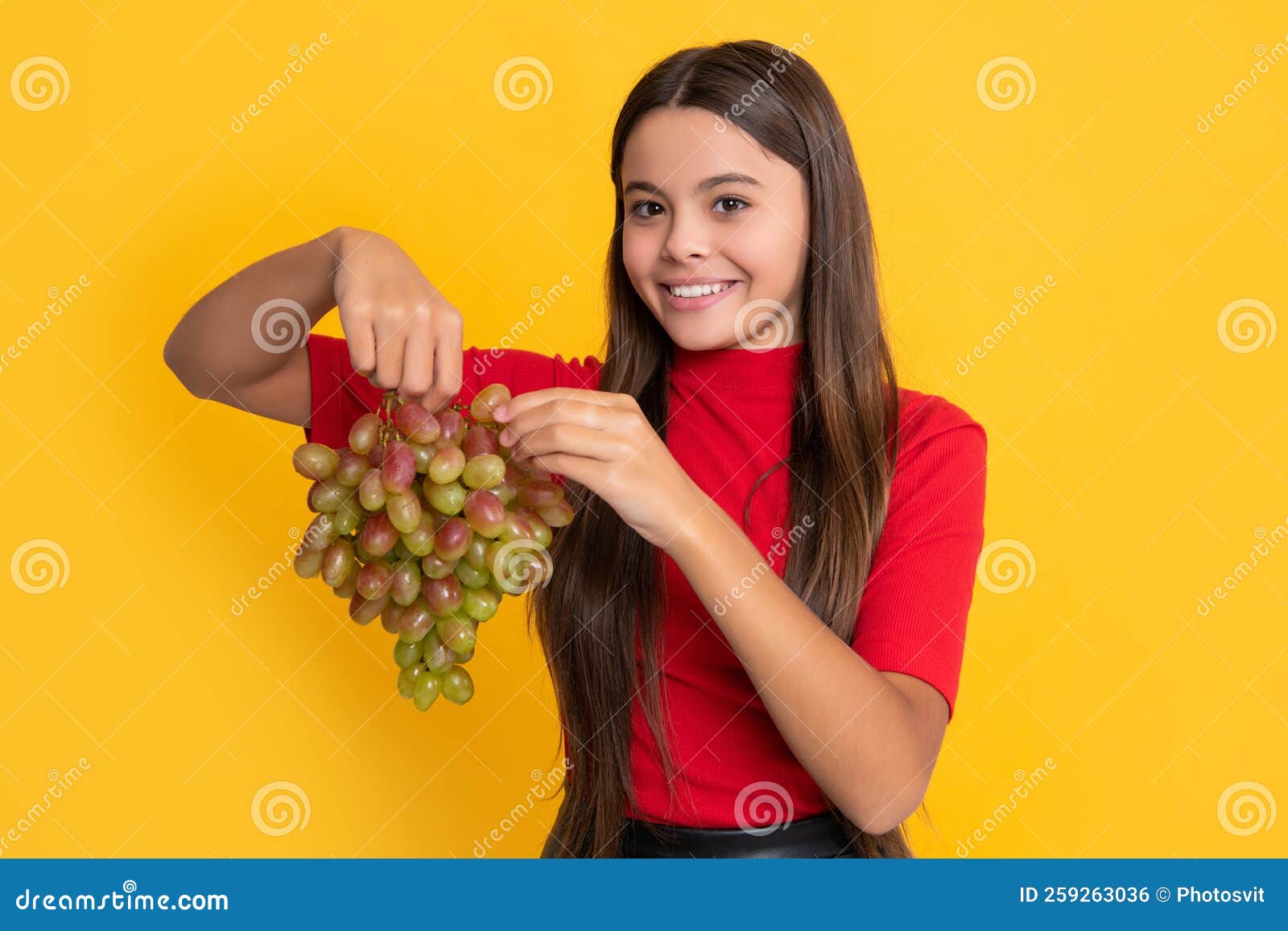 Glad Kid Hold Fresh Grapes Fruit on Yellow Background Stock Photo ...