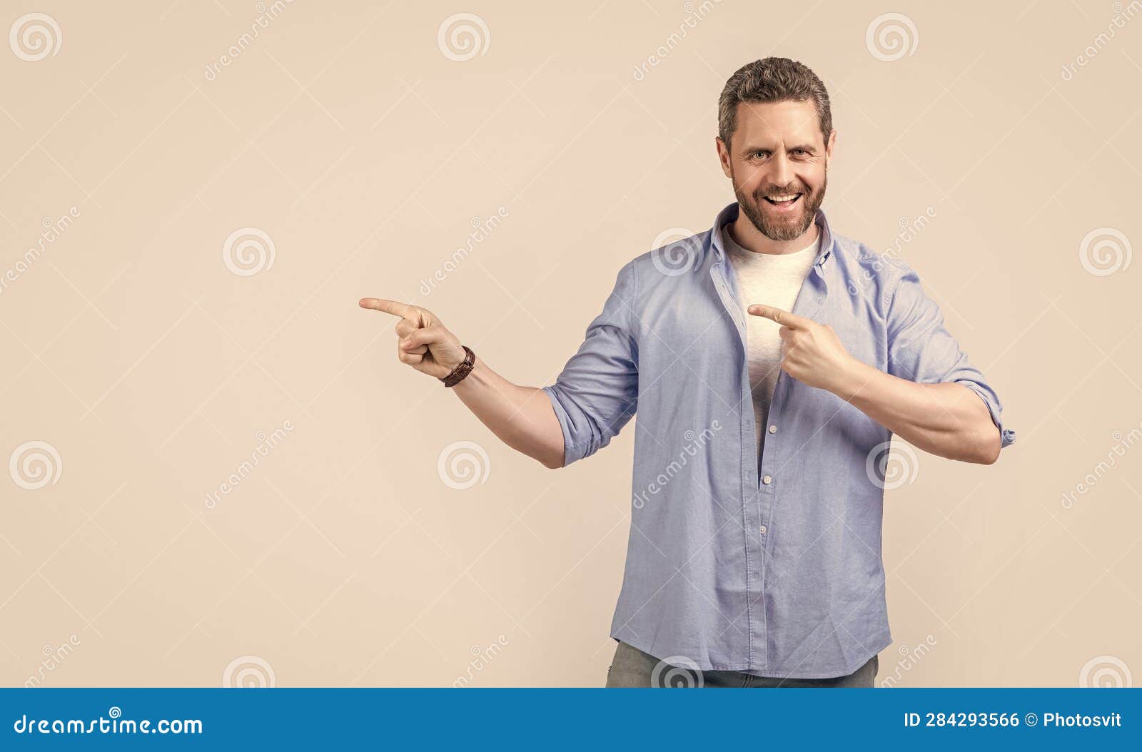Glad Man Pointing and Offer Advertisement in Studio. Photo of Man ...