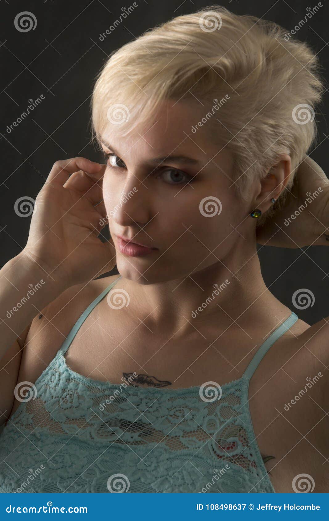 Glamorous Head And Shoulders Portrait Of Young Blonde Woman Stock