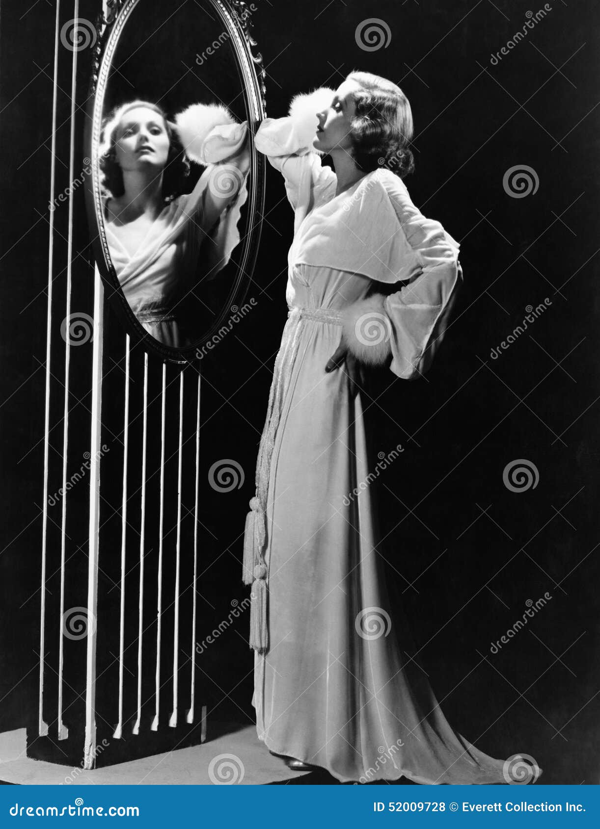 Glamorous Woman Looking in Mirror Stock Photo - Image of formal ...