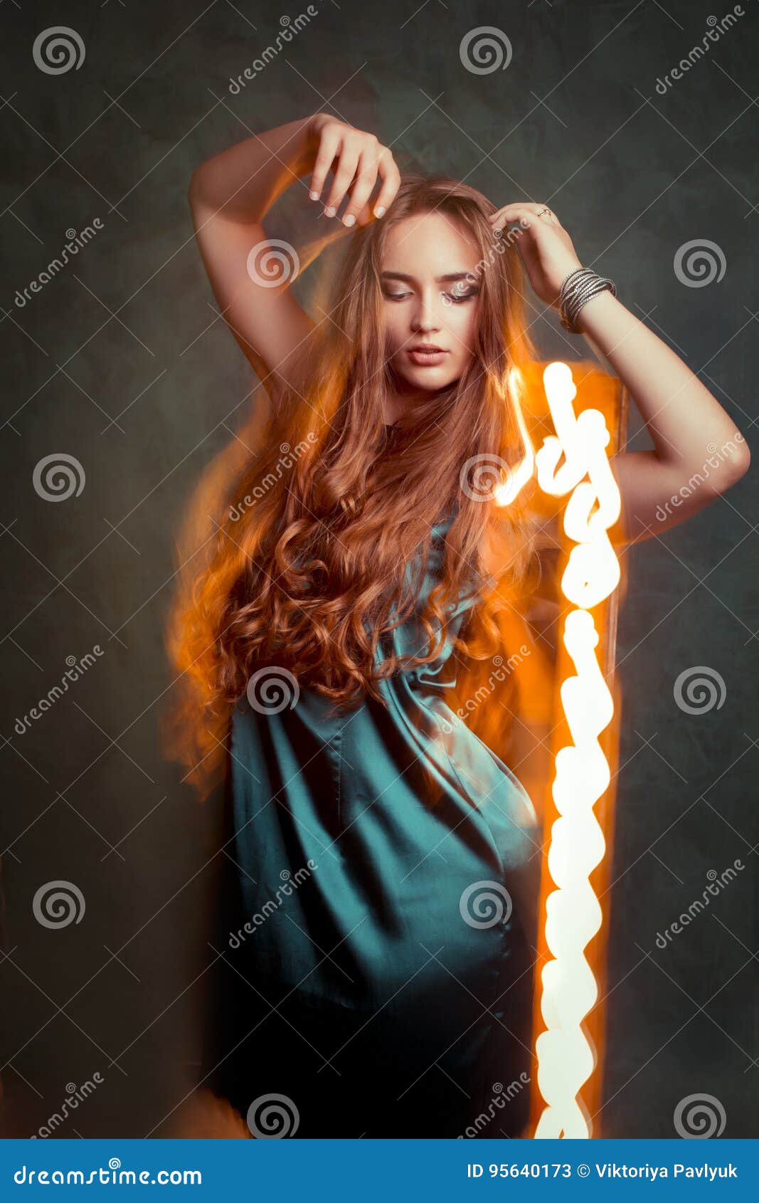 Glamorous Young Woman Dancing in Mixed Light at Studio Stock Image ...