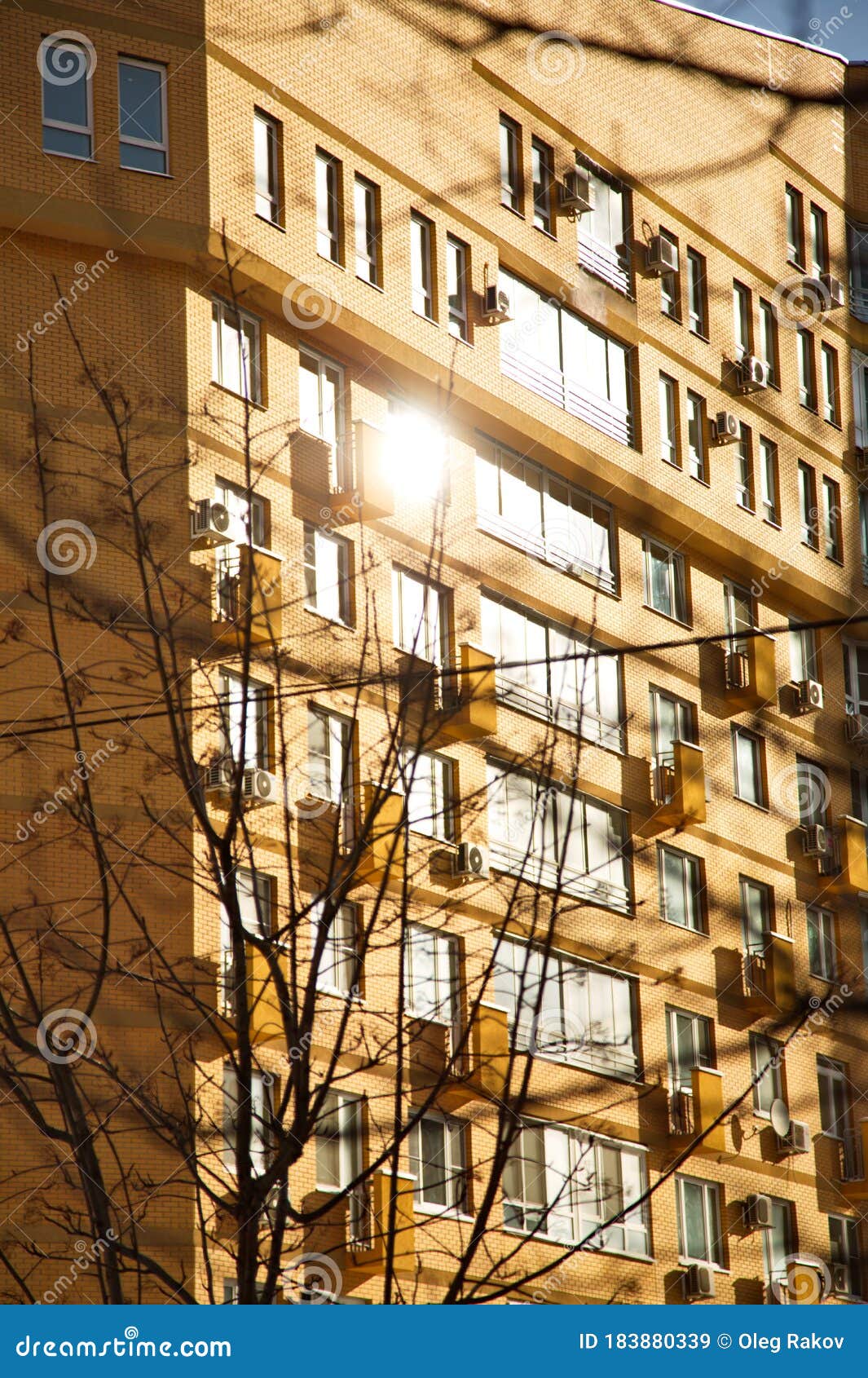 Sun Glare in the Windows of an Apartment Building. Stock Image - Image ...