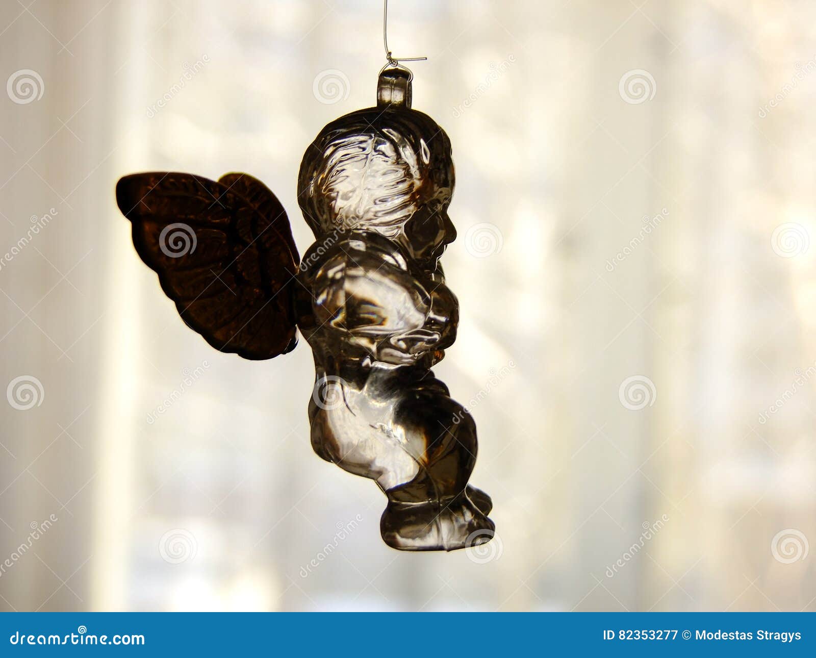 Glass Angel in Front of Window Stock Image - Image of little, angel ...
