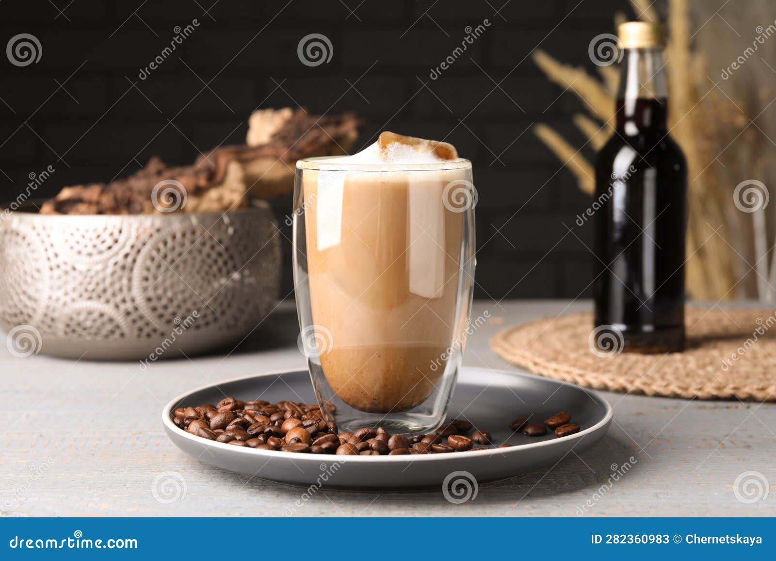 Glass of Aromatic Coffee with Syrup and Beans on Light Grey Table Stock ...
