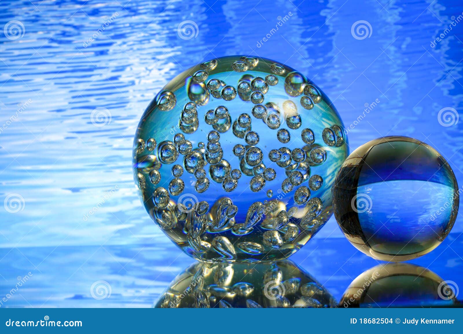 Glass Balls in Front of Blue Water Stock Photo - Image of shiny, detail ...