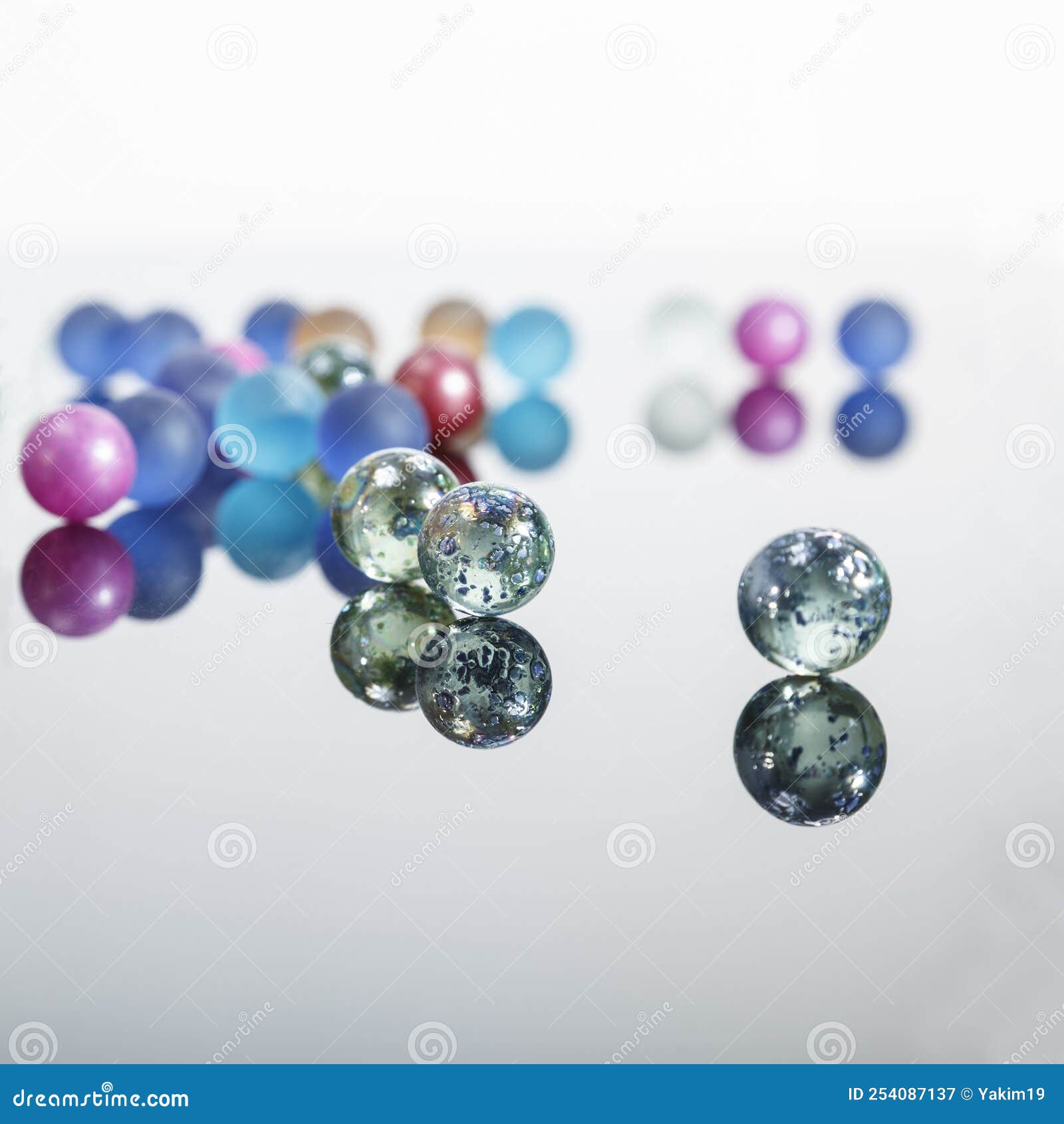 Glass Balls with Reflection on Shiny Surface Stock Image - Image of ...
