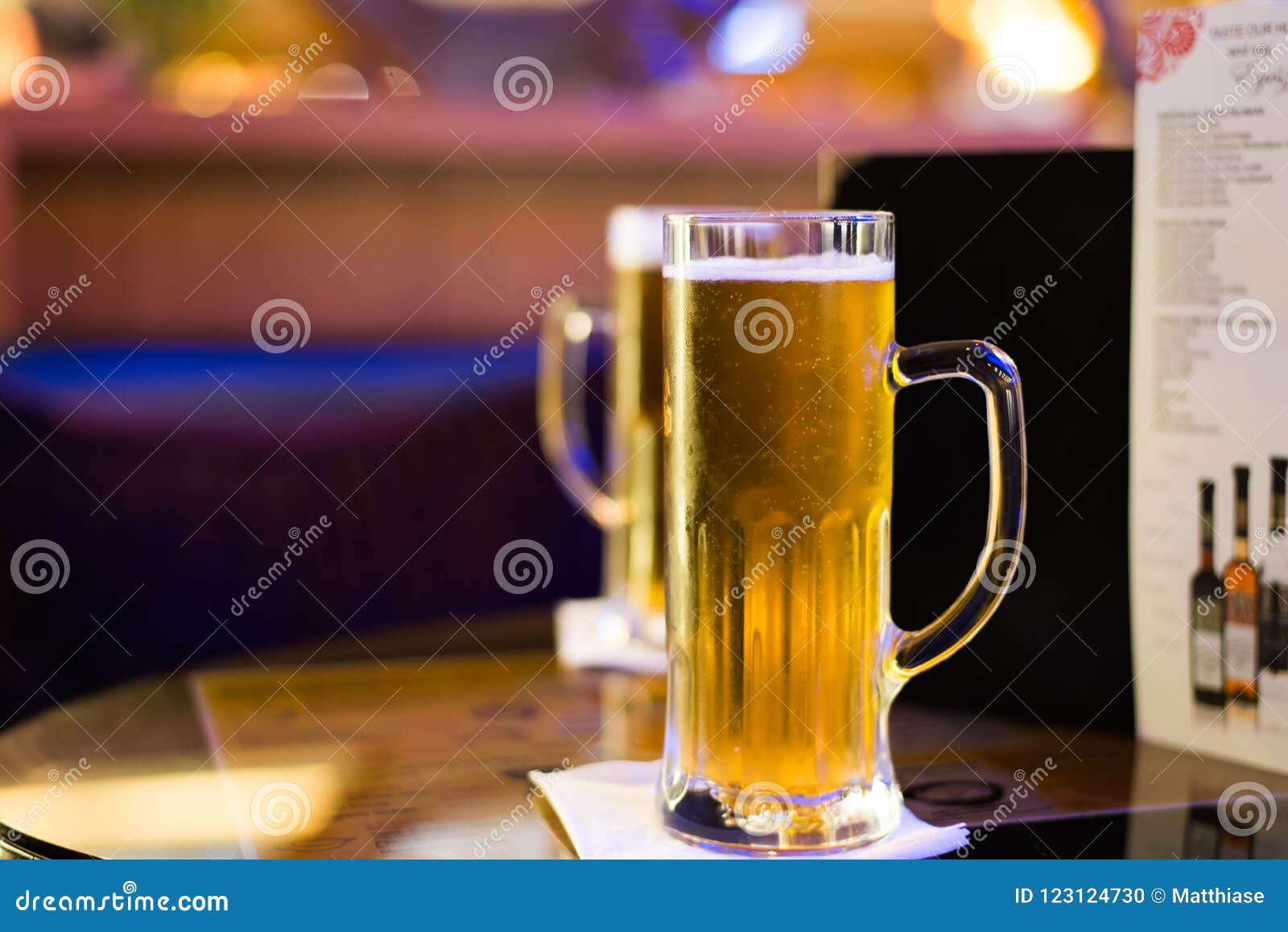 Glass of beer on bar table stock photo. Image of brown - 123124730