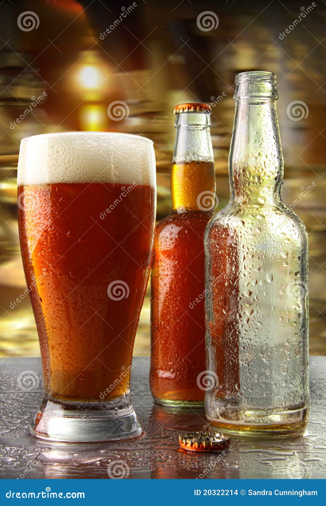 Glass of beer with bottles stock photo. Image of intoxicant - 20322214