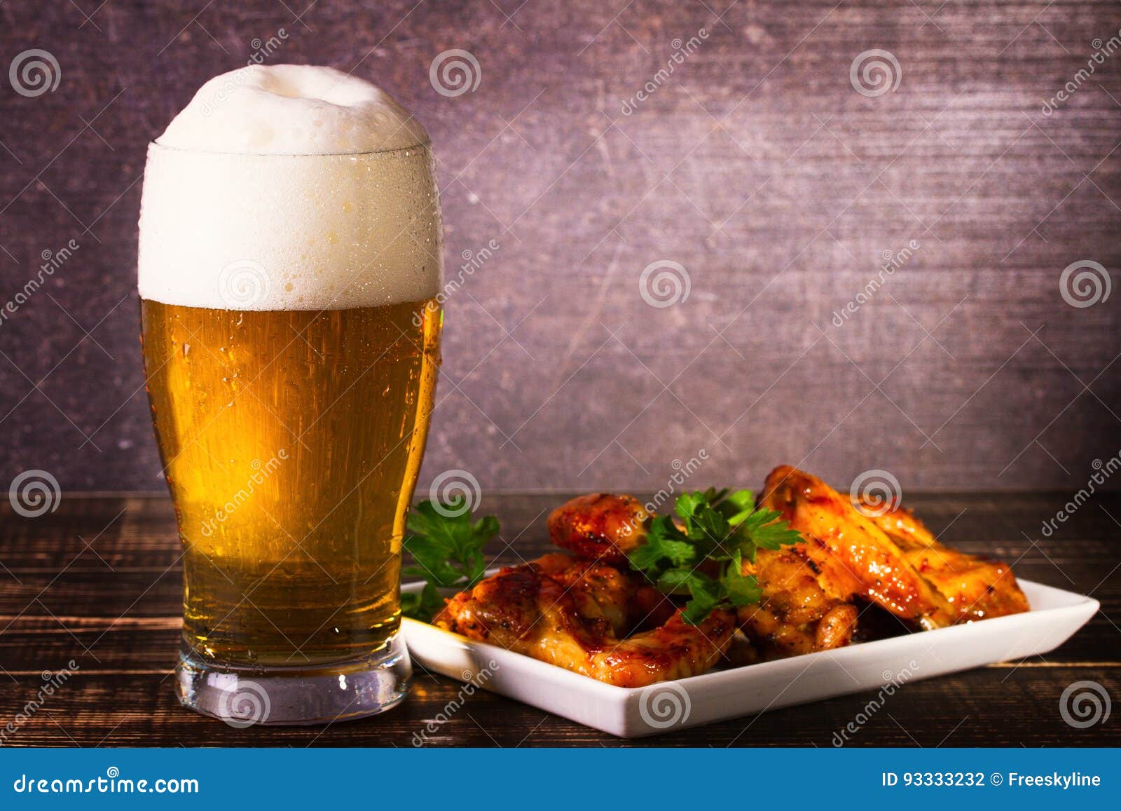 Glass of Beer and Buffalo Chicken Wings. Beer Bites. Stock Photo ...
